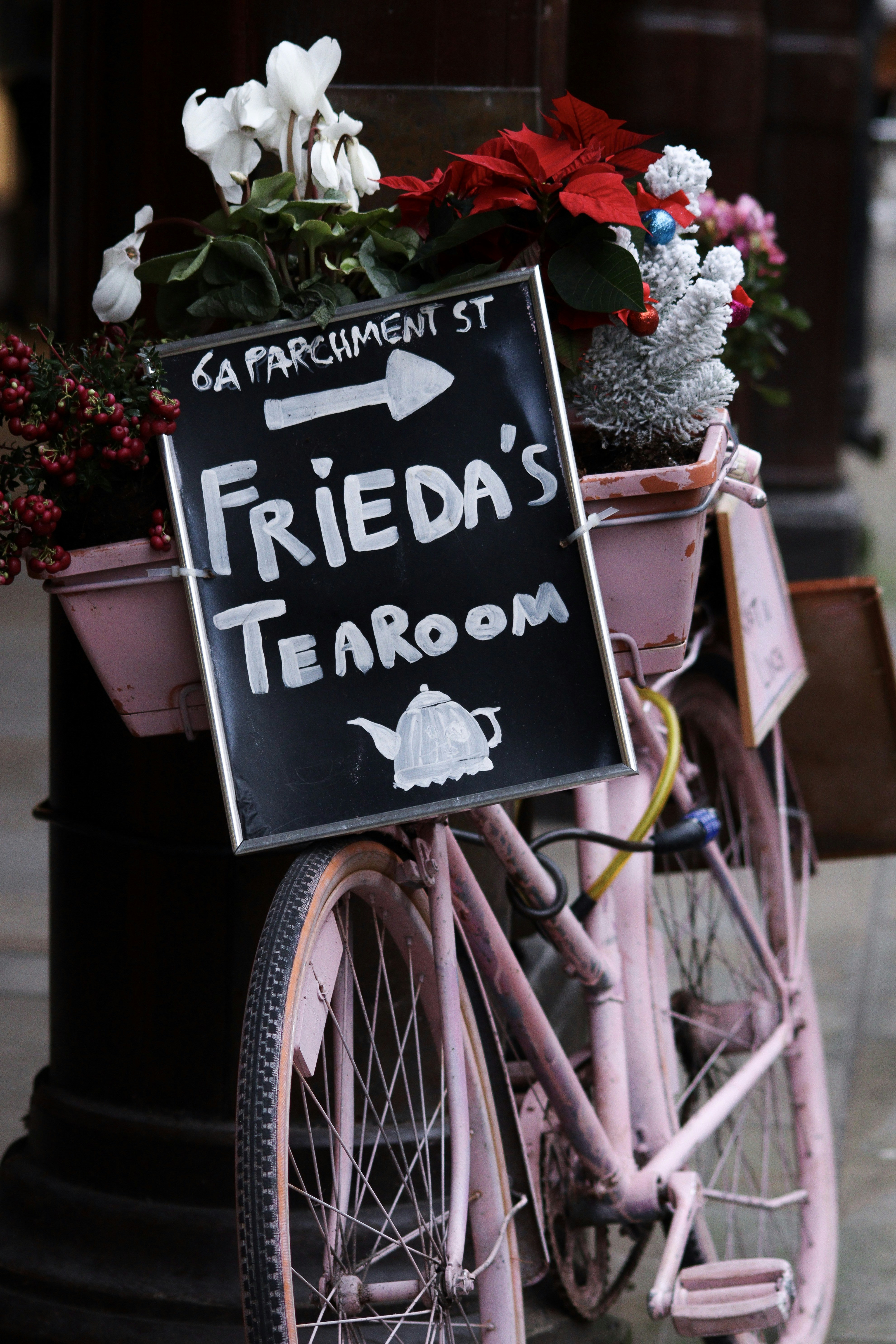 Pedal-Painted Teahouse: A Pink Bicycle Brimming with Blooms and Chalkboard Signage