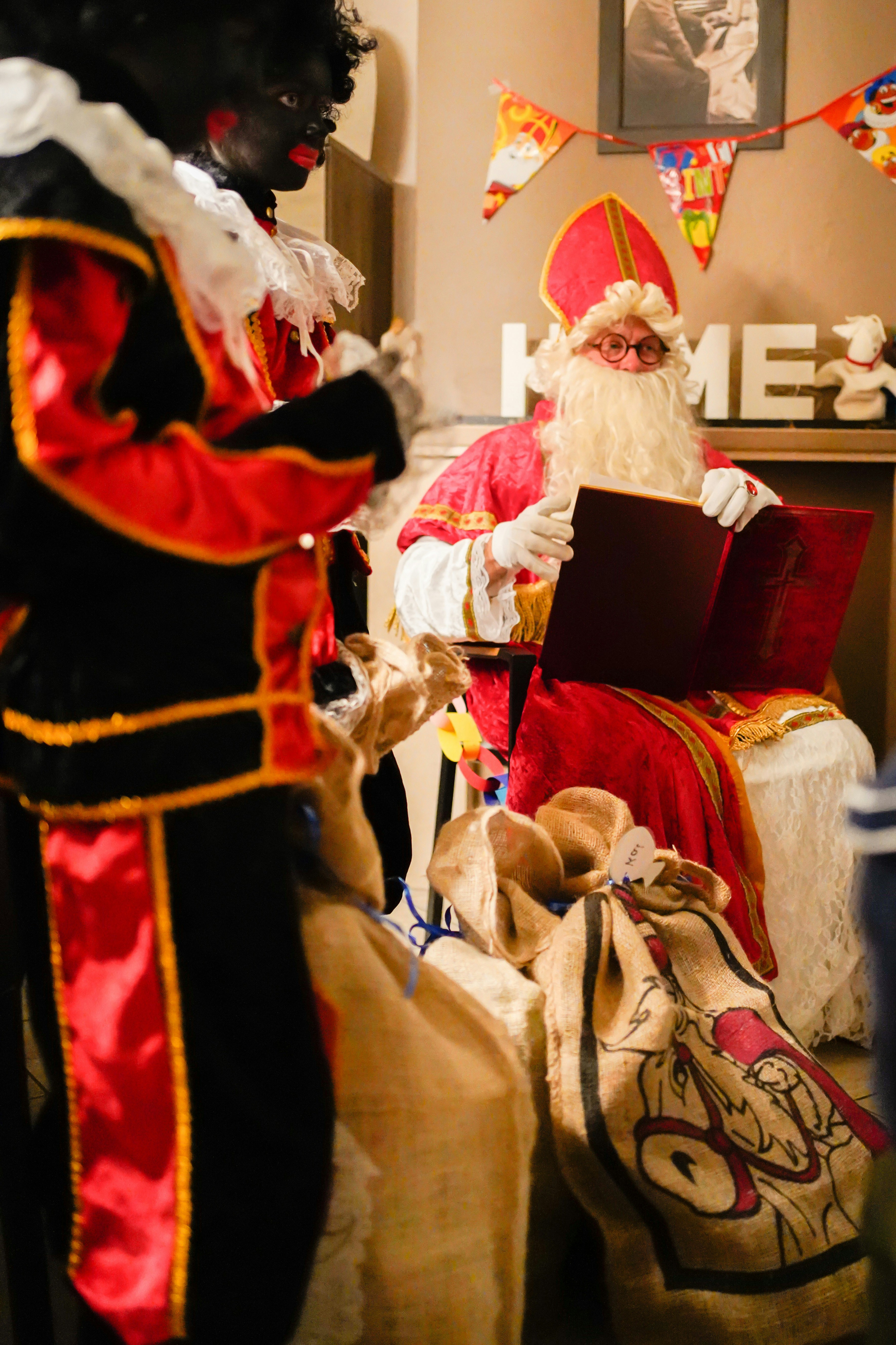 Reading Santa by the Curtain: A Festive Moment with Helpers