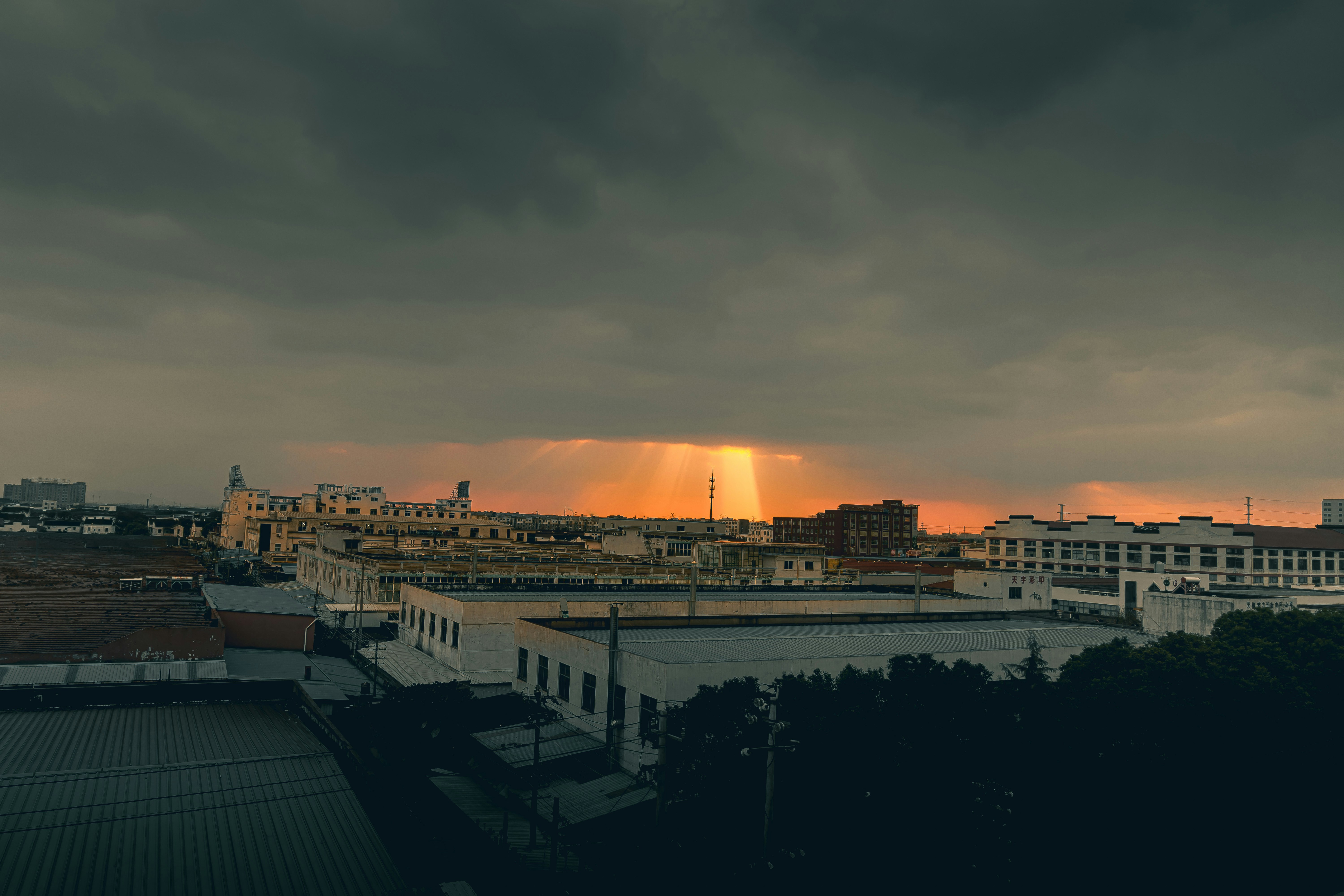 Apex of Light Over an Industrial Horizon