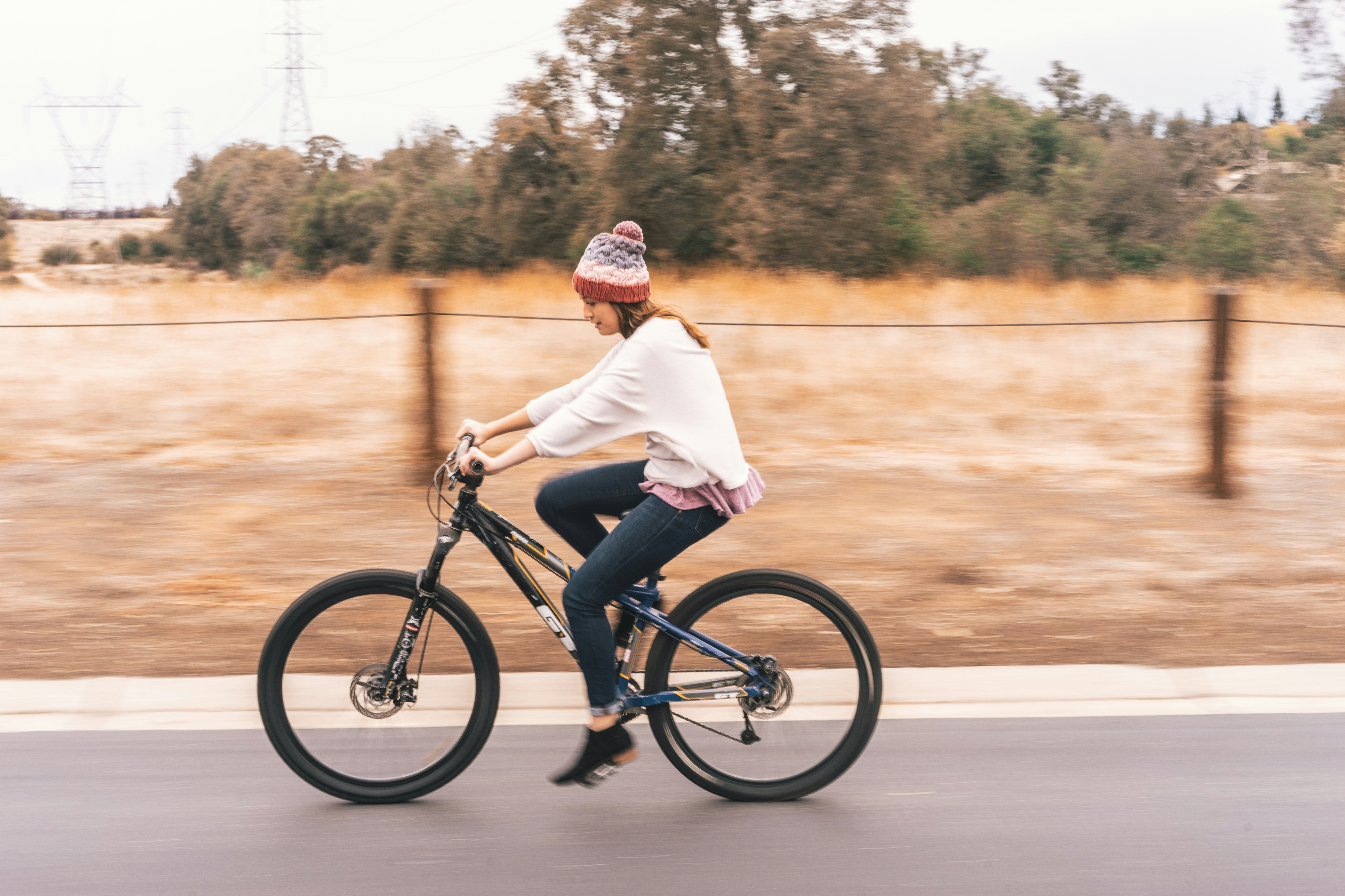 Flying  | woman riding bicycle near tree during daytime