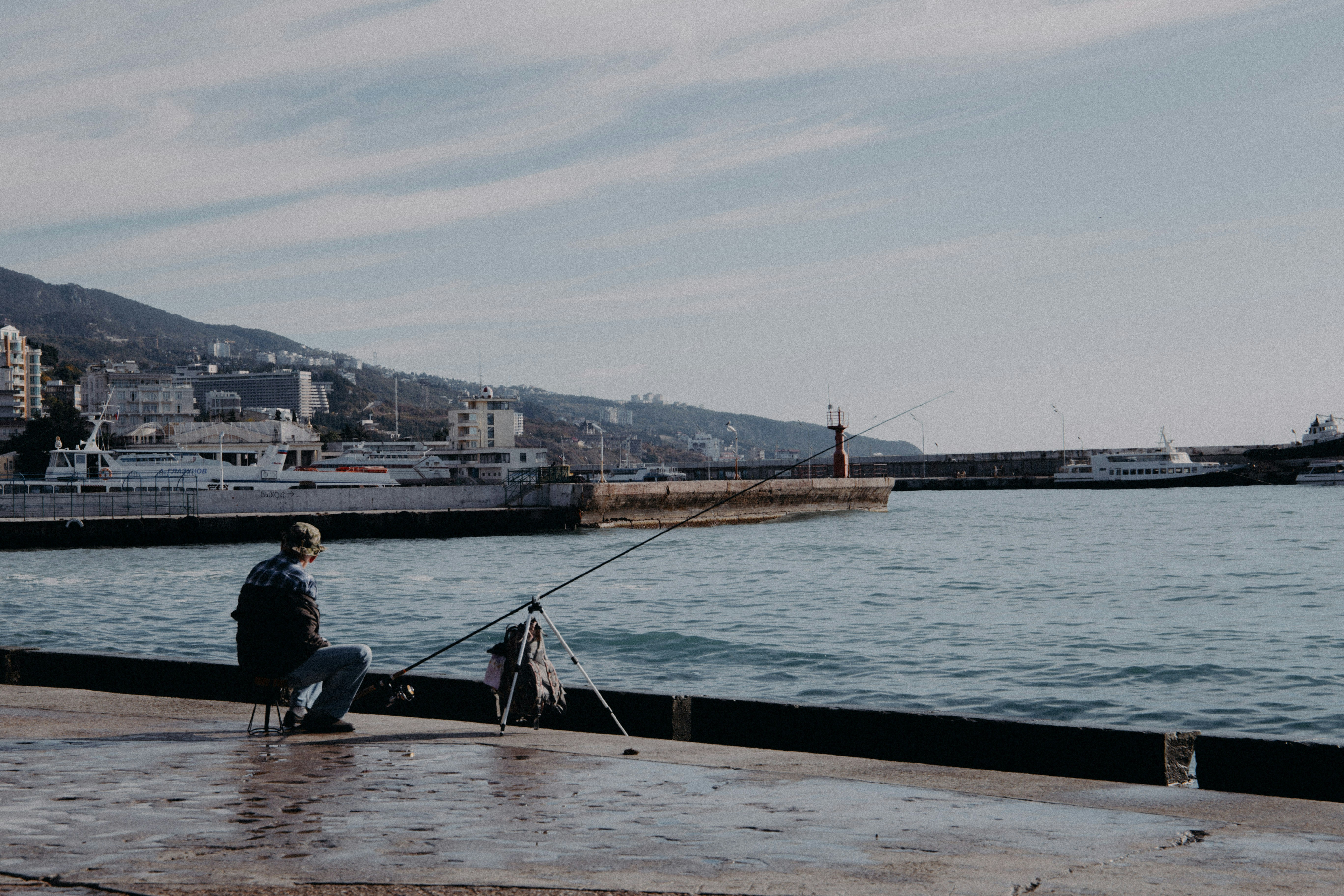 Man fishing during daytime photo – Free Grey Image on Unsplash