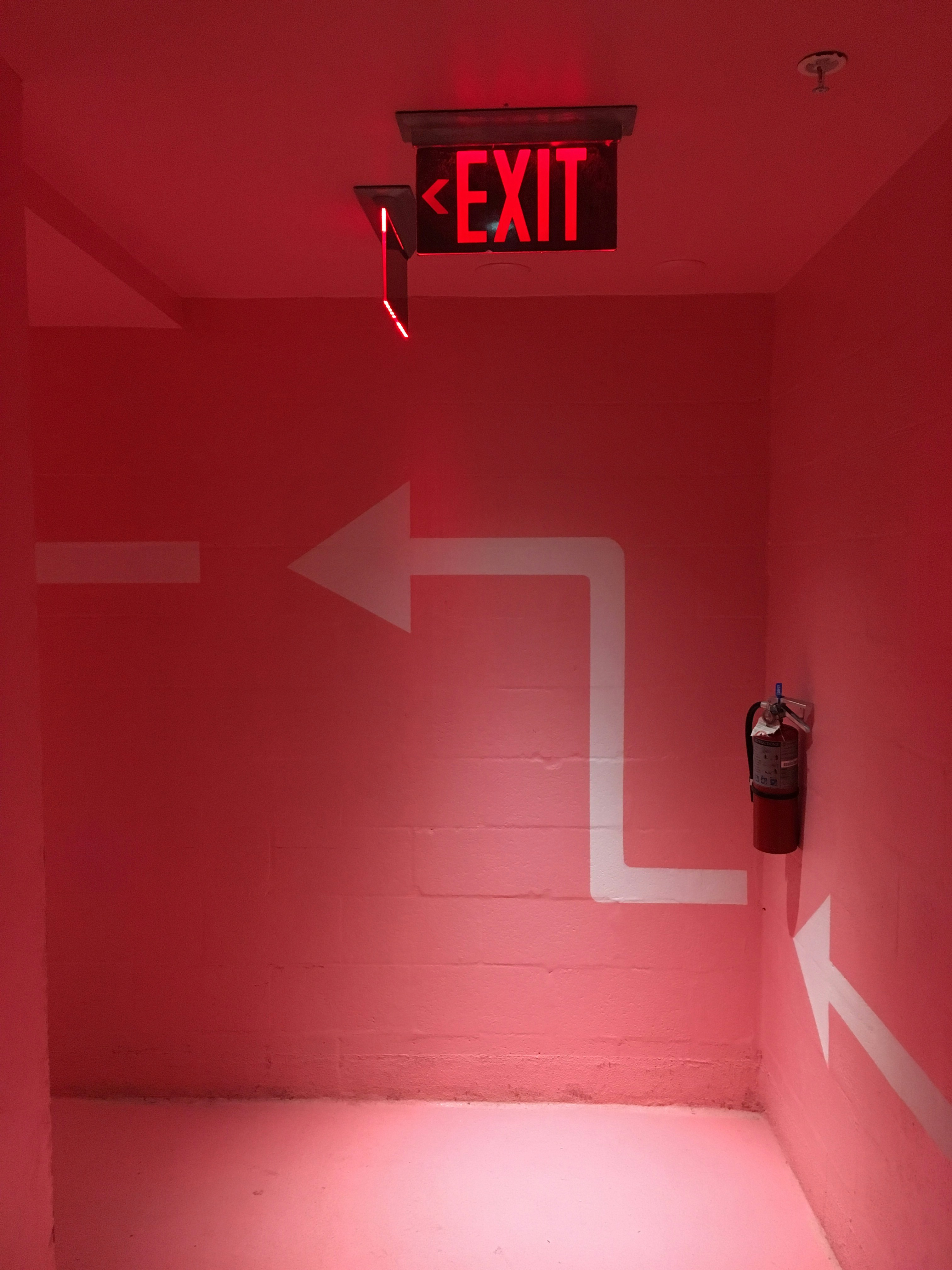 Crimson Corridor: Exit Sign and Arrow Pathway