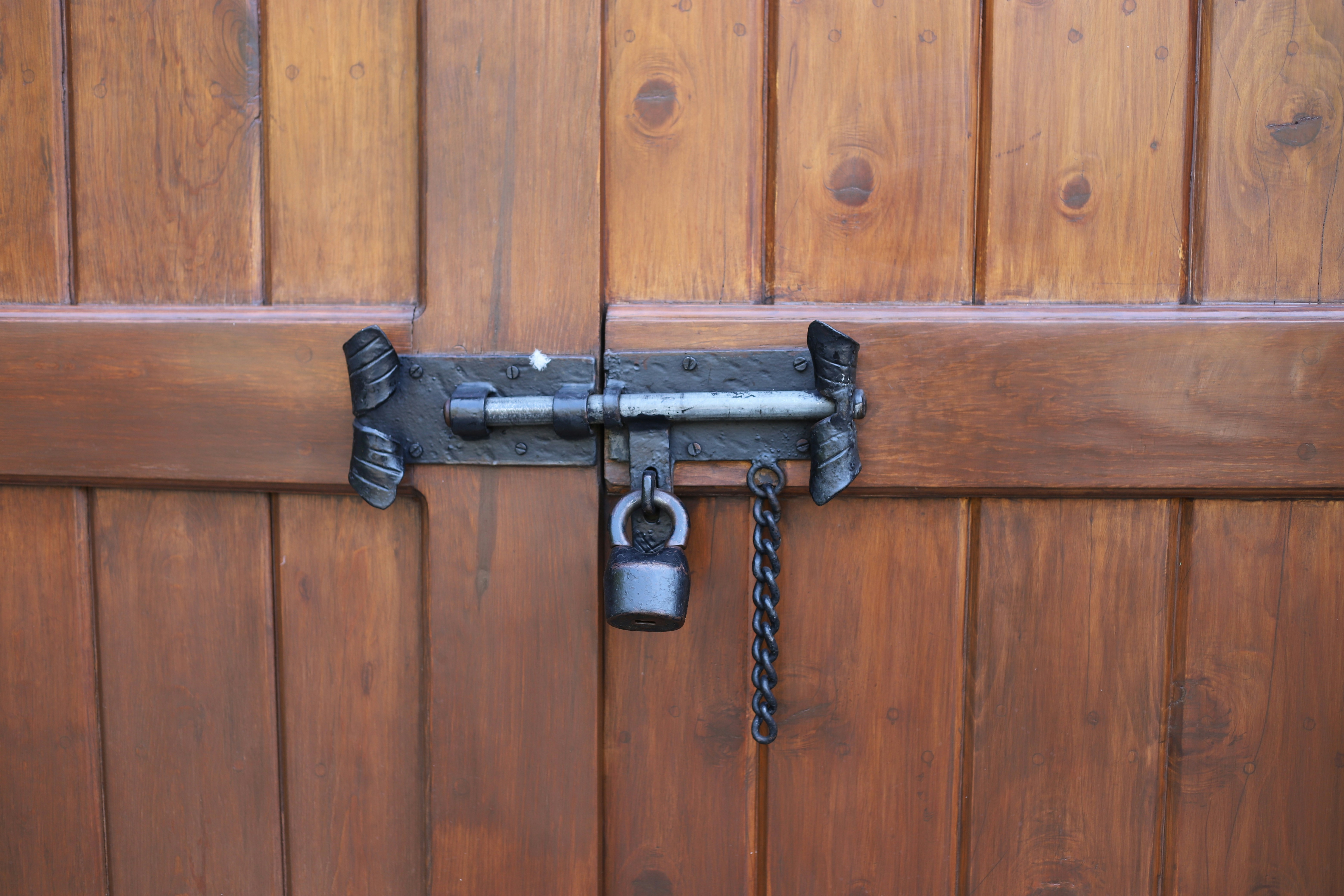 Lock and Lintel: A Quiet Moment of Security on Weathered Wood