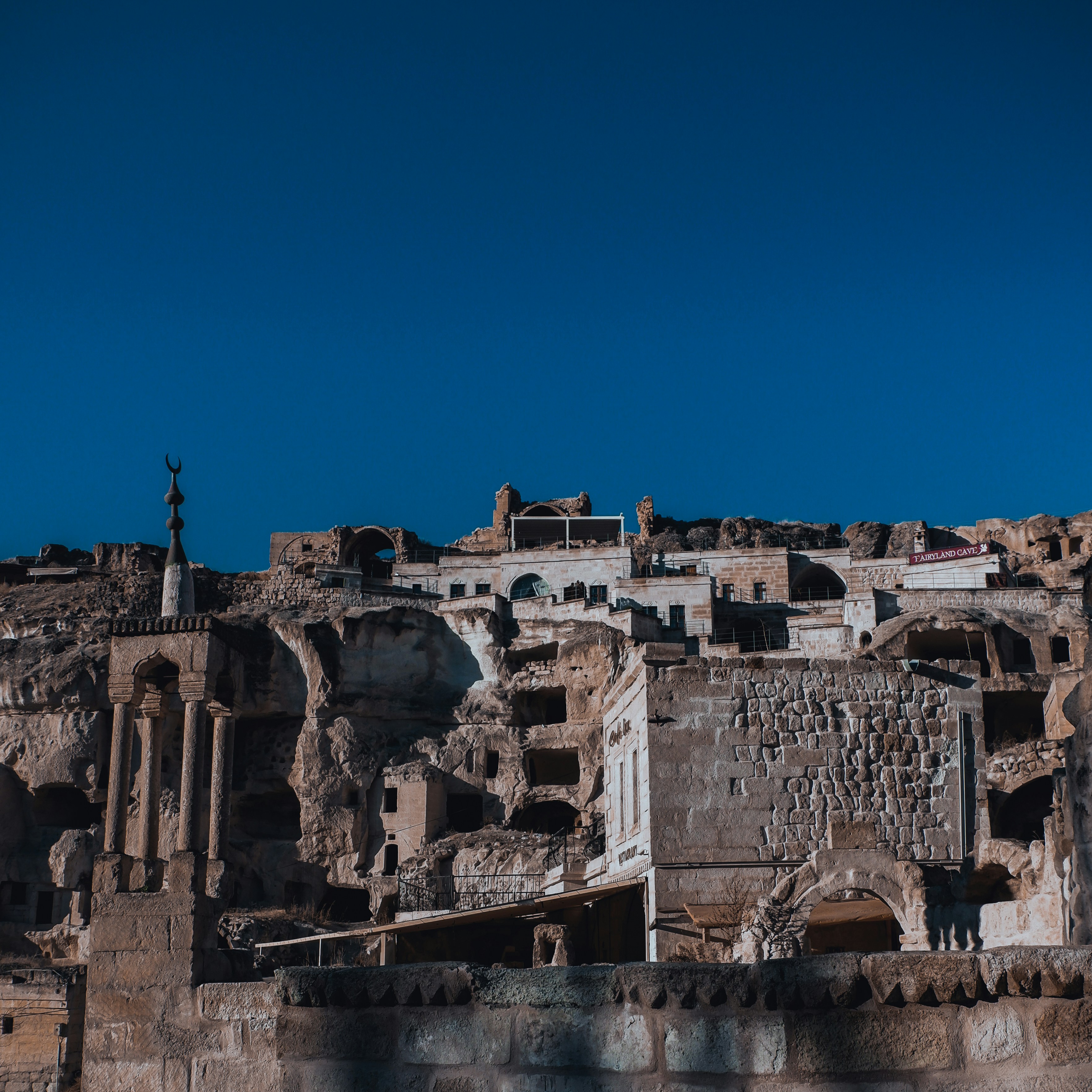 Brown buildings under blue sky photo – Free Cappadocia Image on Unsplash