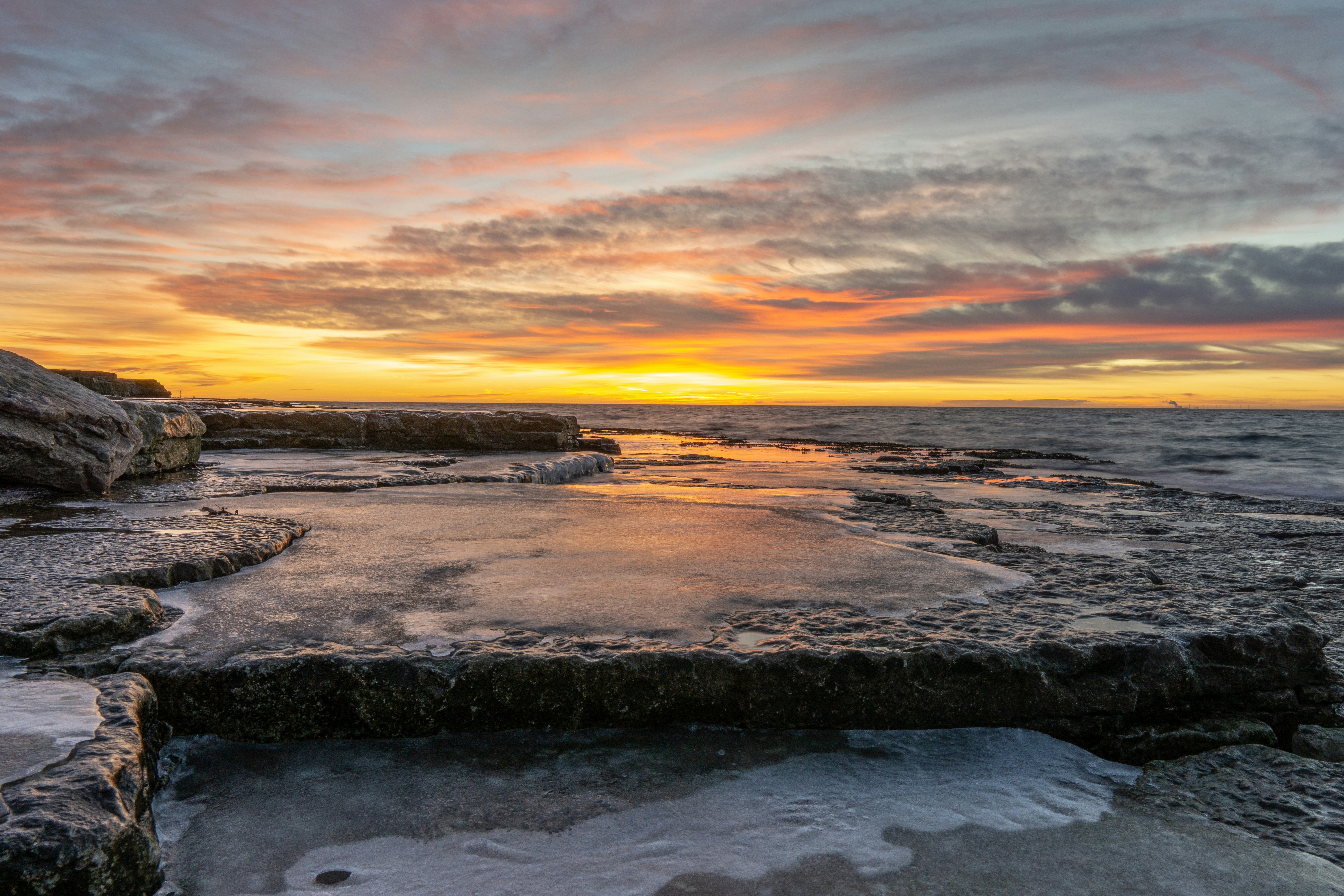 Terraced Rock Pools at Sunset: Light Steps to the Quiet Sea