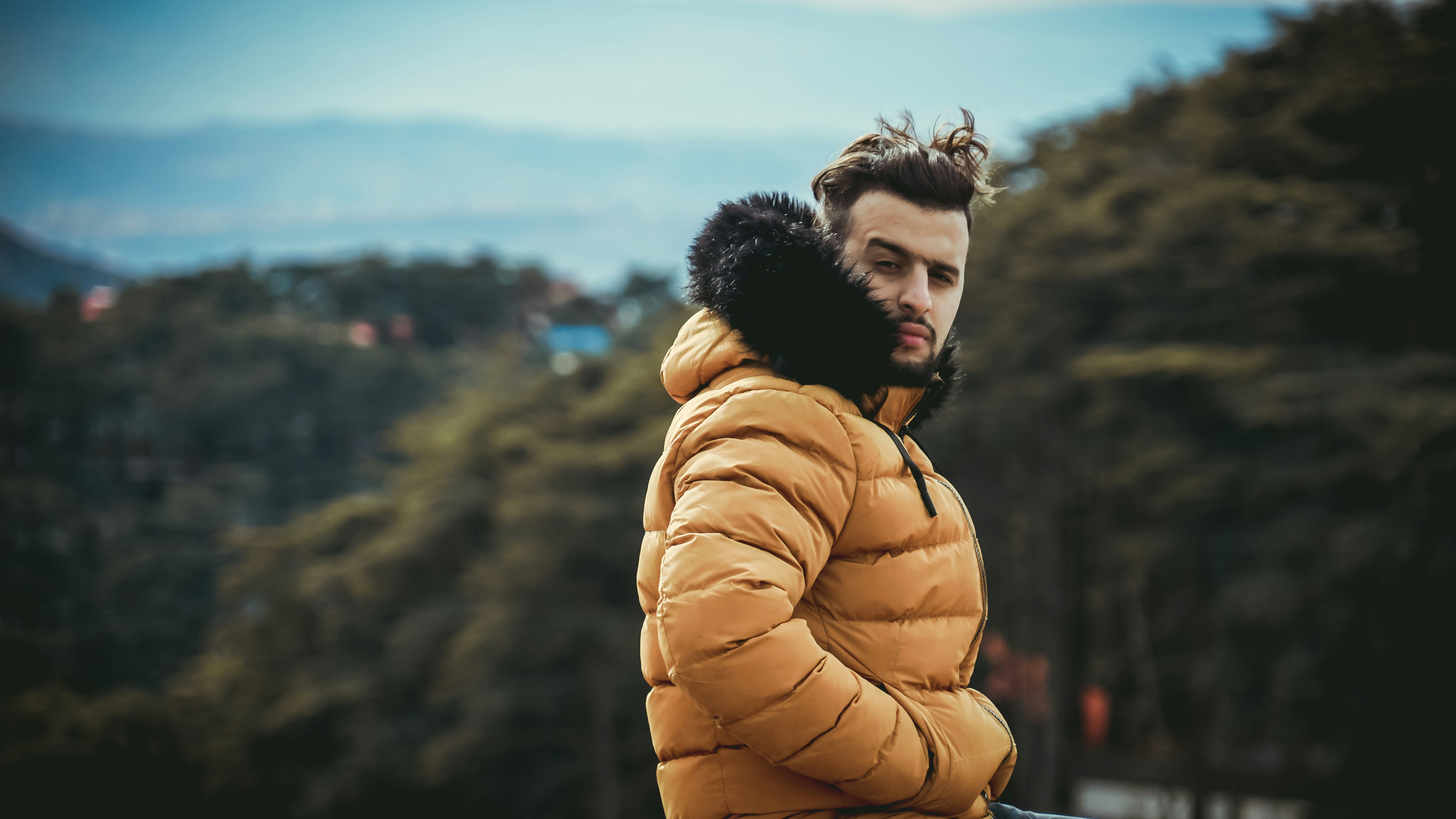 man wearing brown bubble jacket