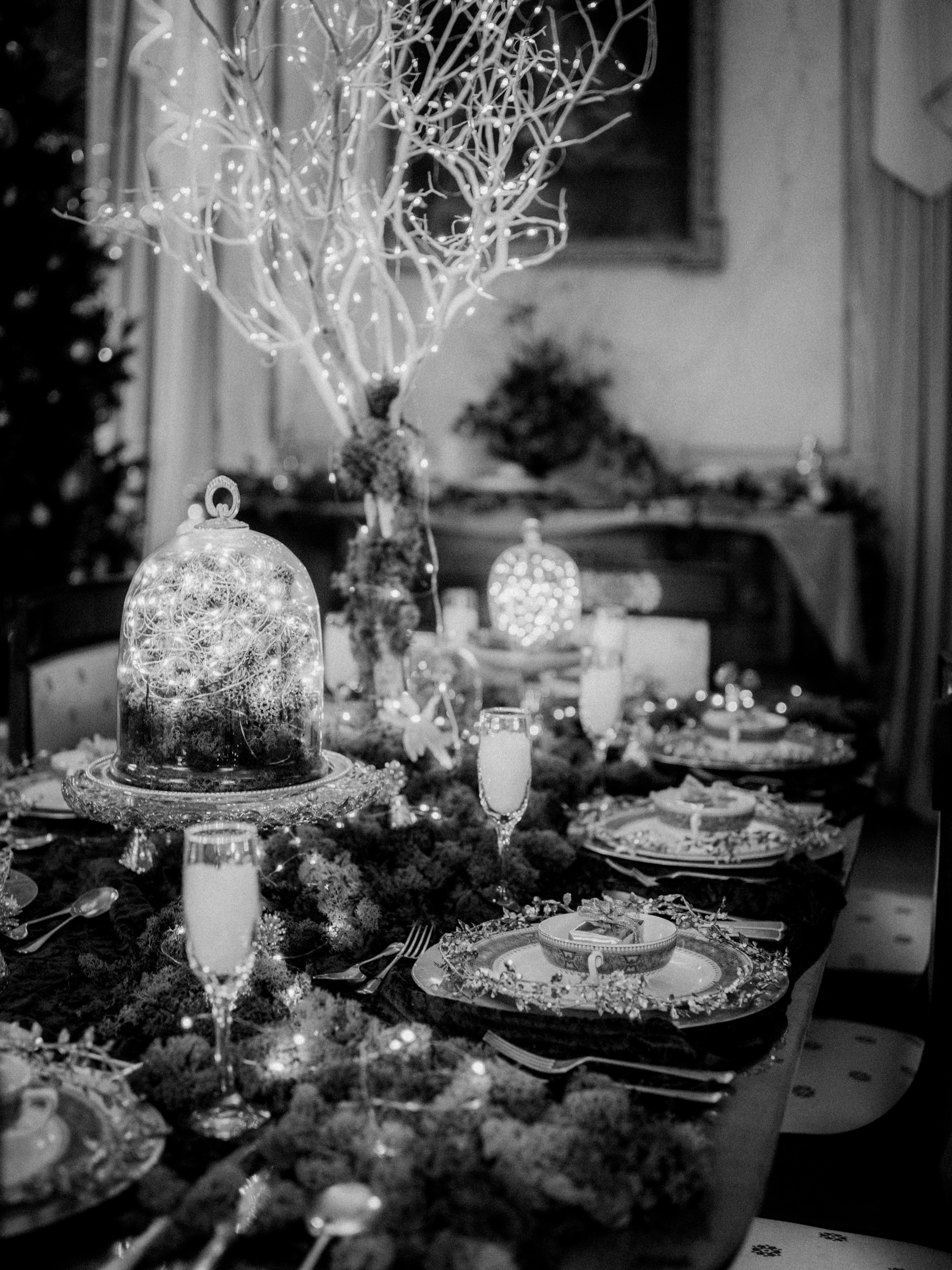 Glass Dome Centerpiece Bathes in Fairy-Light Glow Across a Festive Table