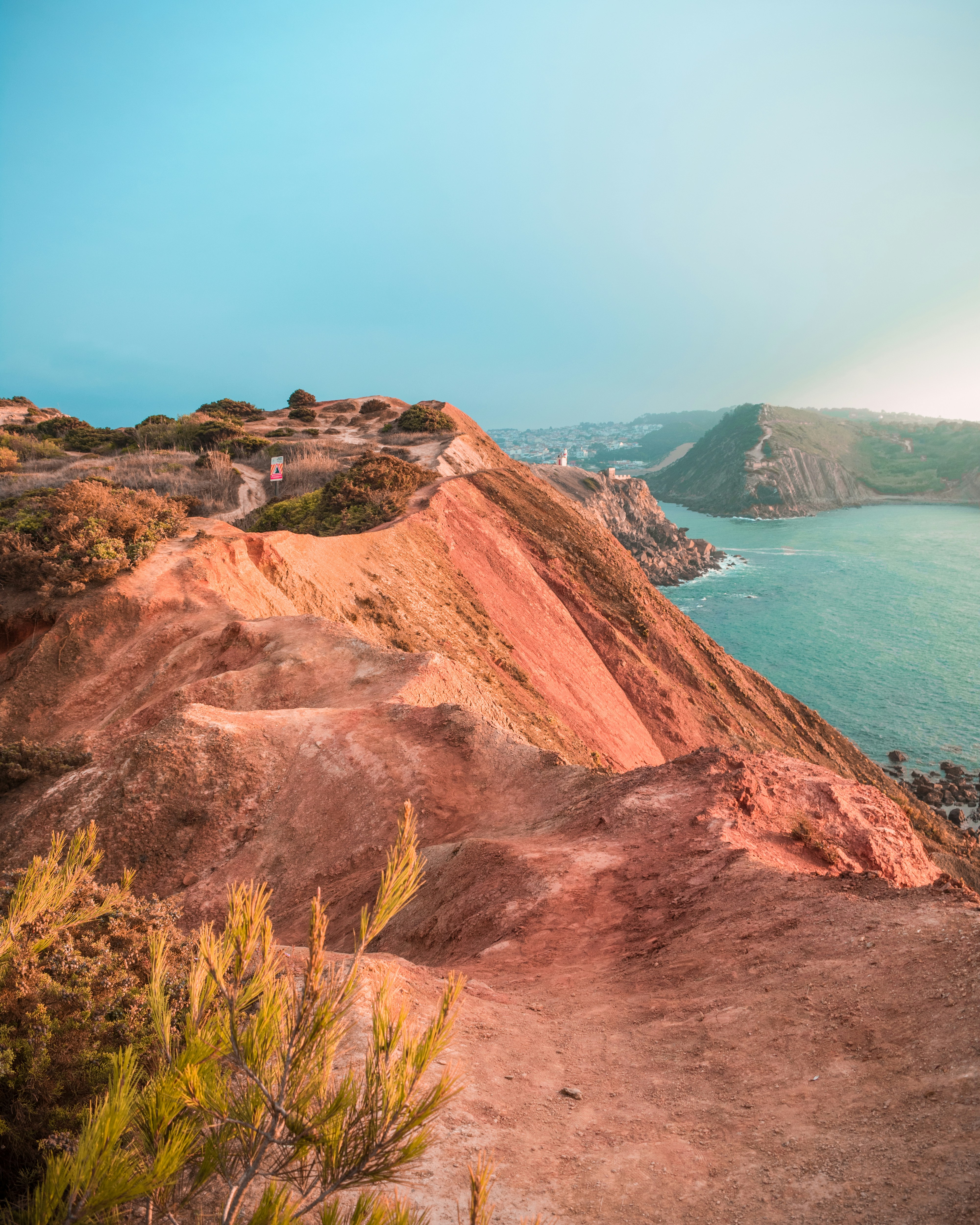 Crimson Ridge Over Turquoise Horizons