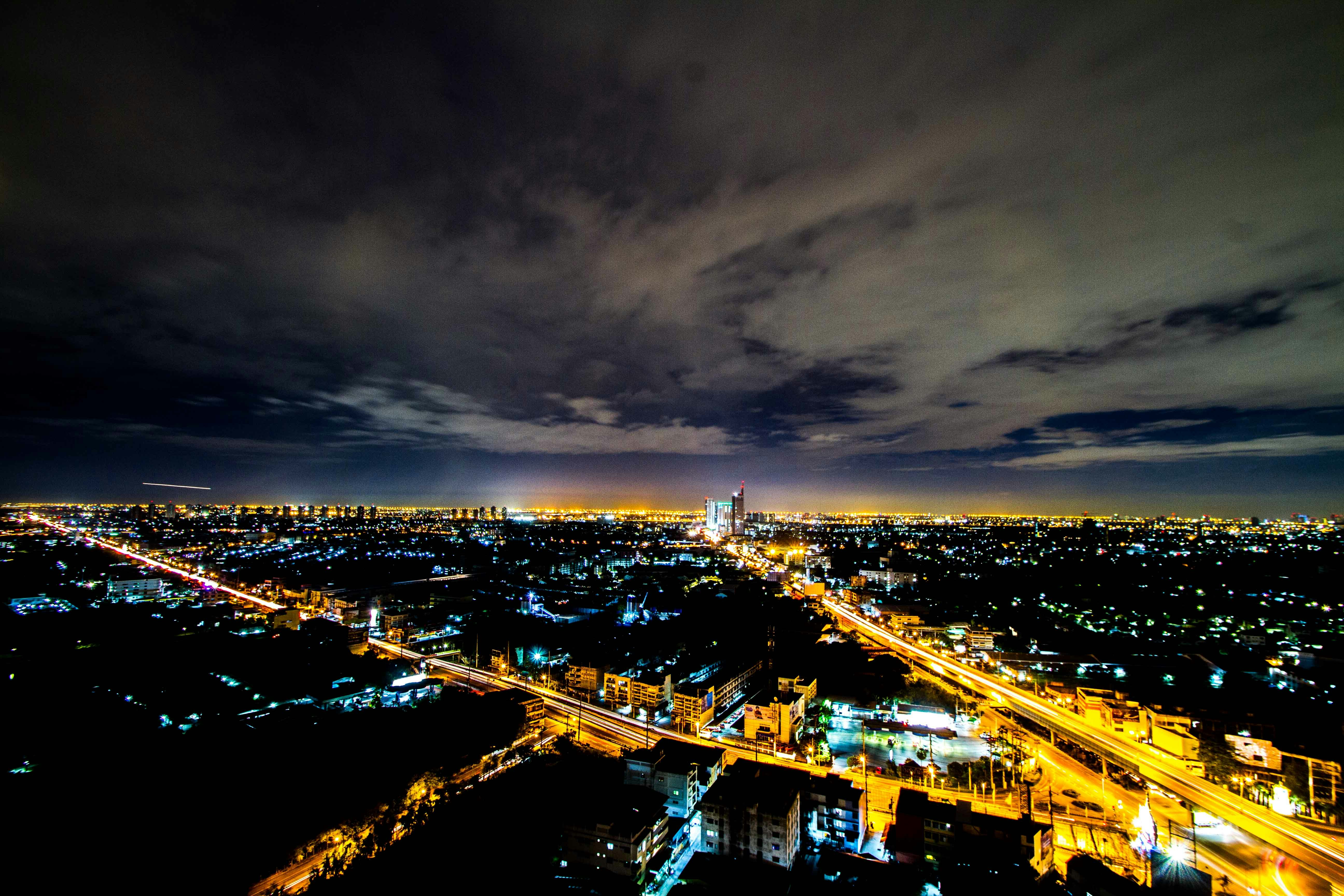 Aerial photography of lighted city high rise buildings during nighttime ...
