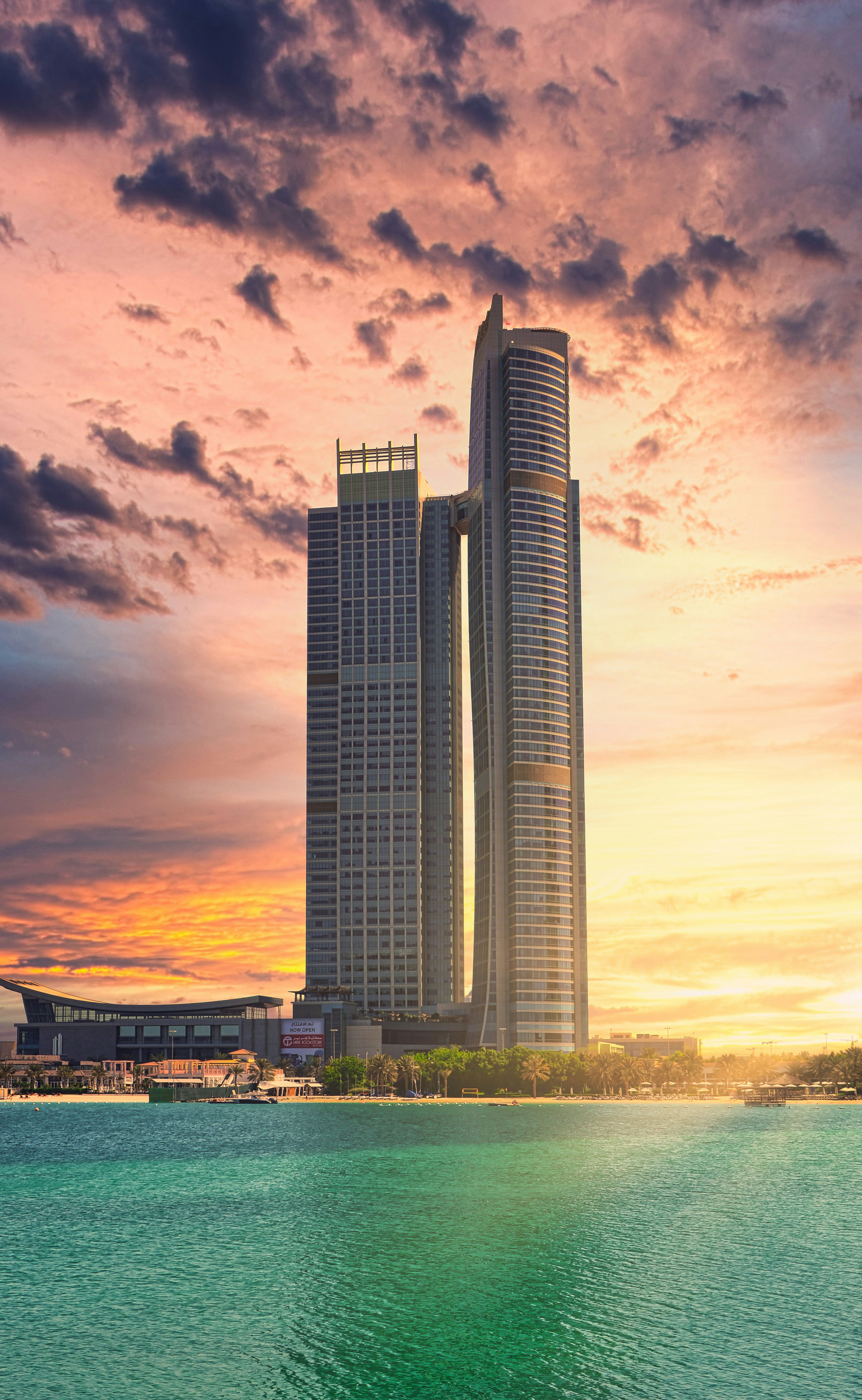 Sunset Over the Glass Twin Towers by Turquoise Harbor