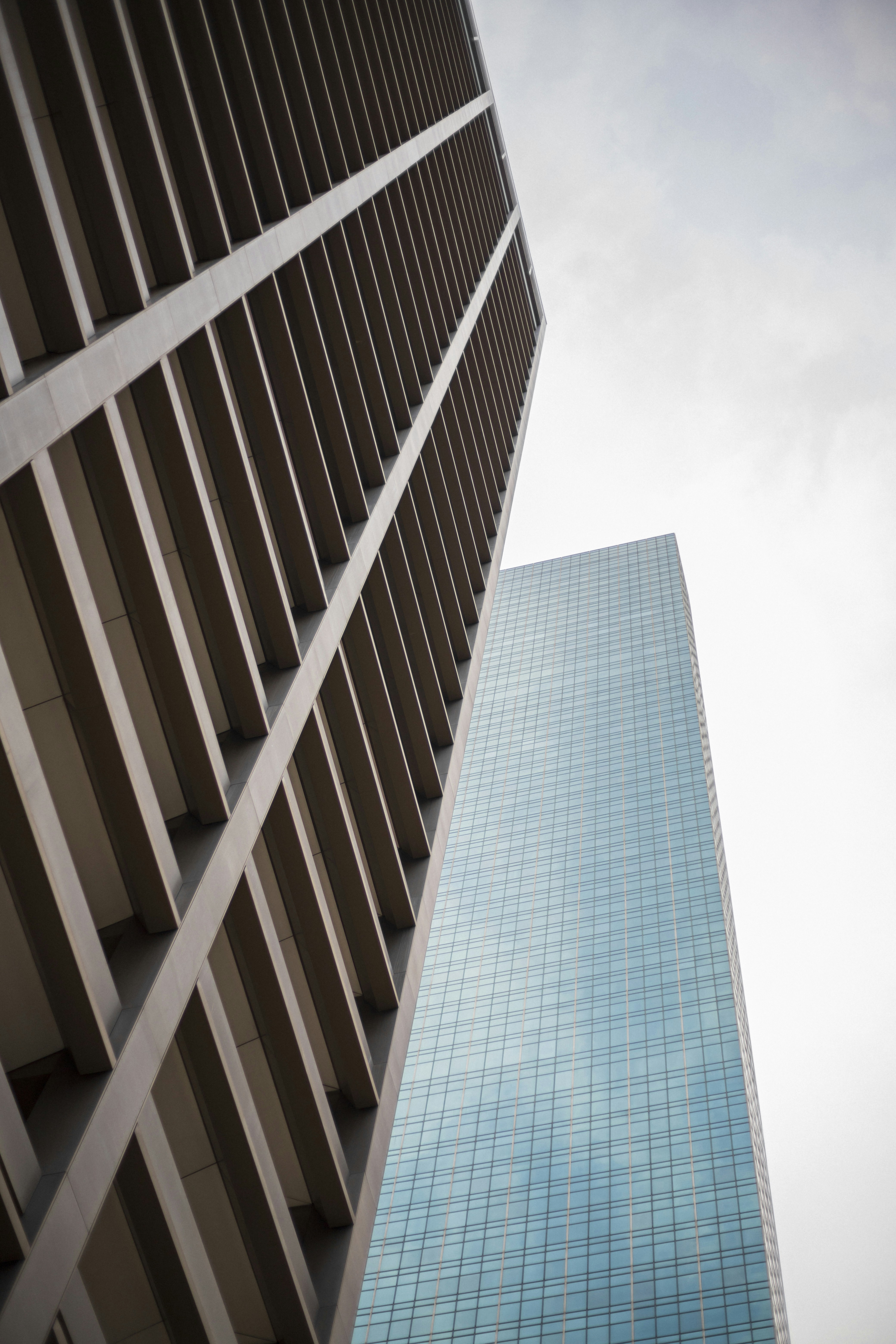 Worm view photo of gray building under cloudysky photo – Free Houston ...