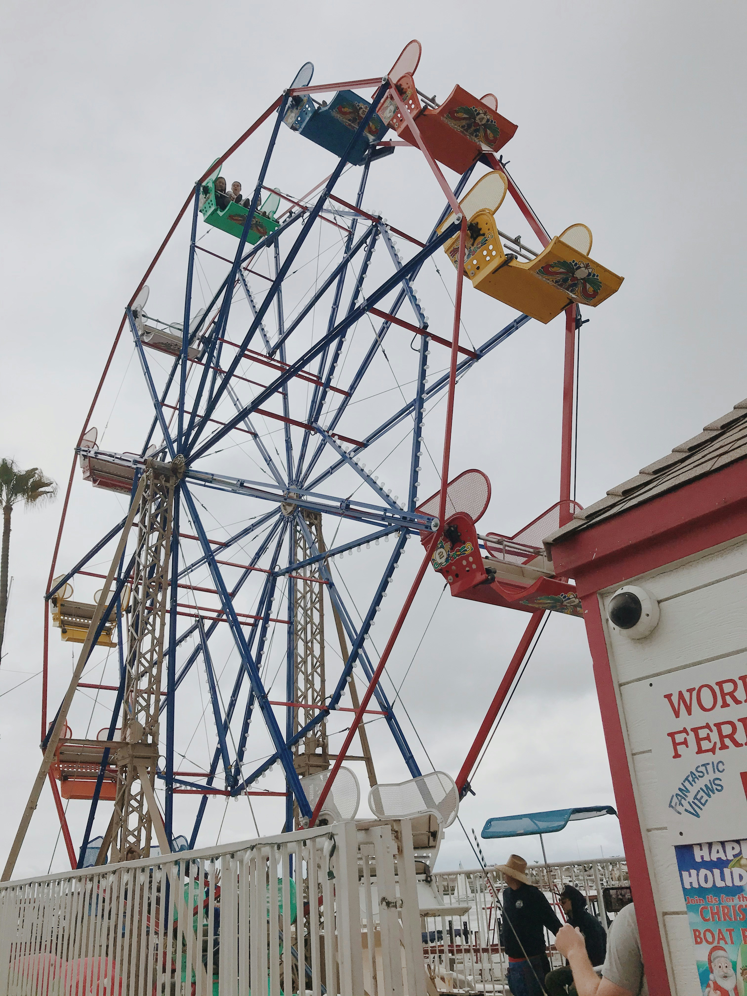 Crisscrossed Steel and Color: A Ferris Wheel at the Edge of the Boardwalk