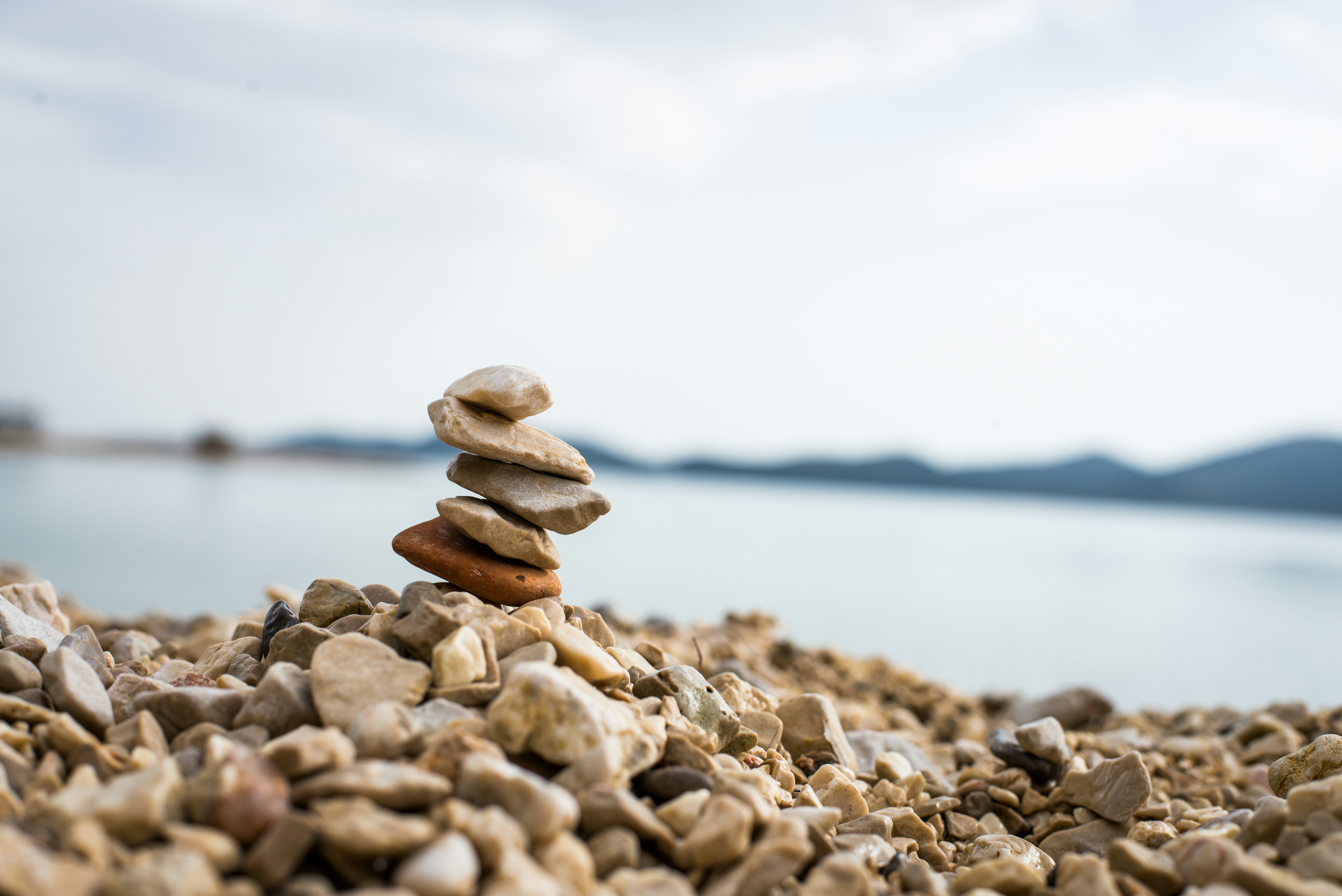 Brown and gray stones near body of water during daytime photo – Free ...