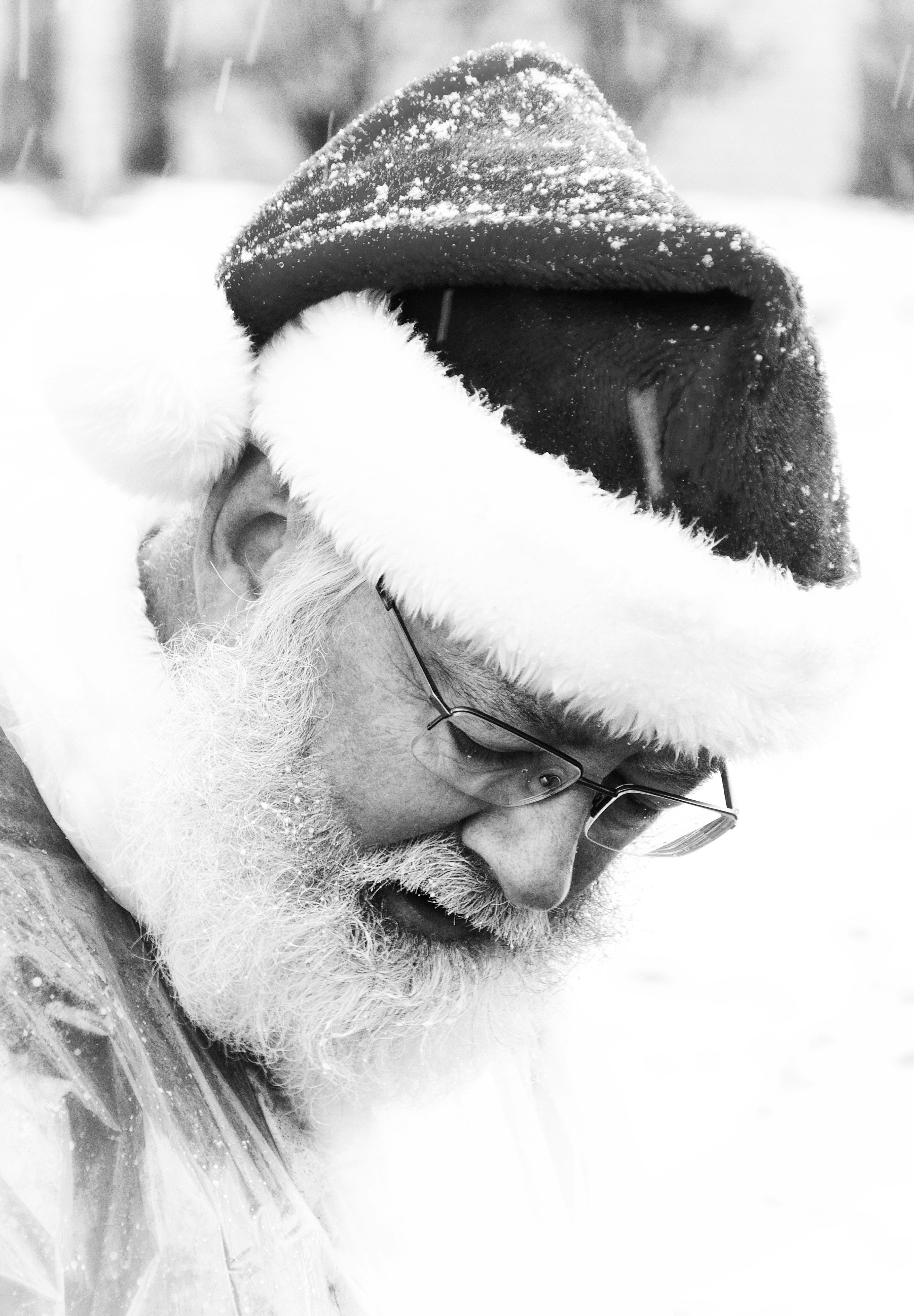 Pensive Santa in the Snow: A Monochrome Moment