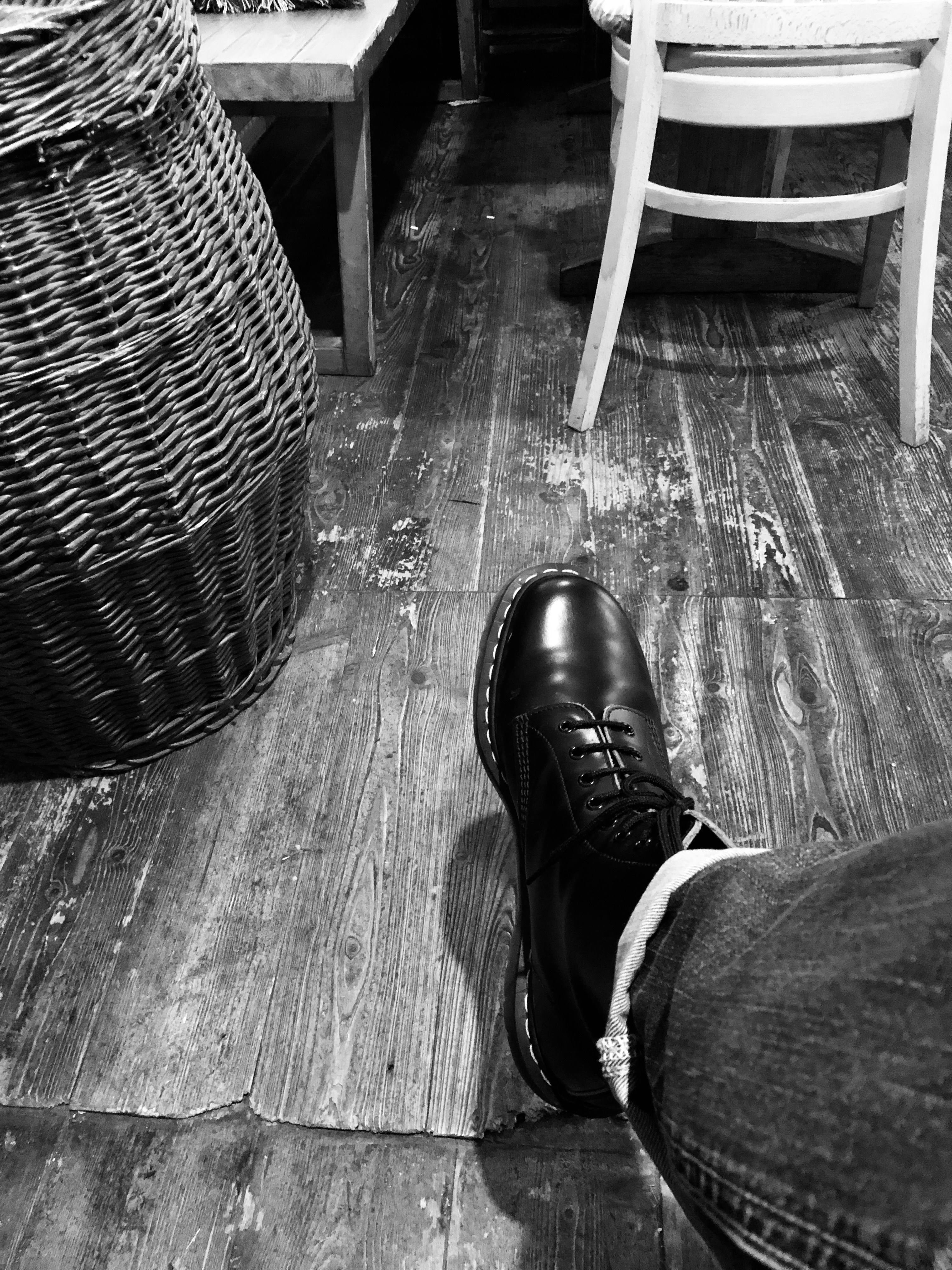 Monochrome Footfalls Across Weathered Planks
