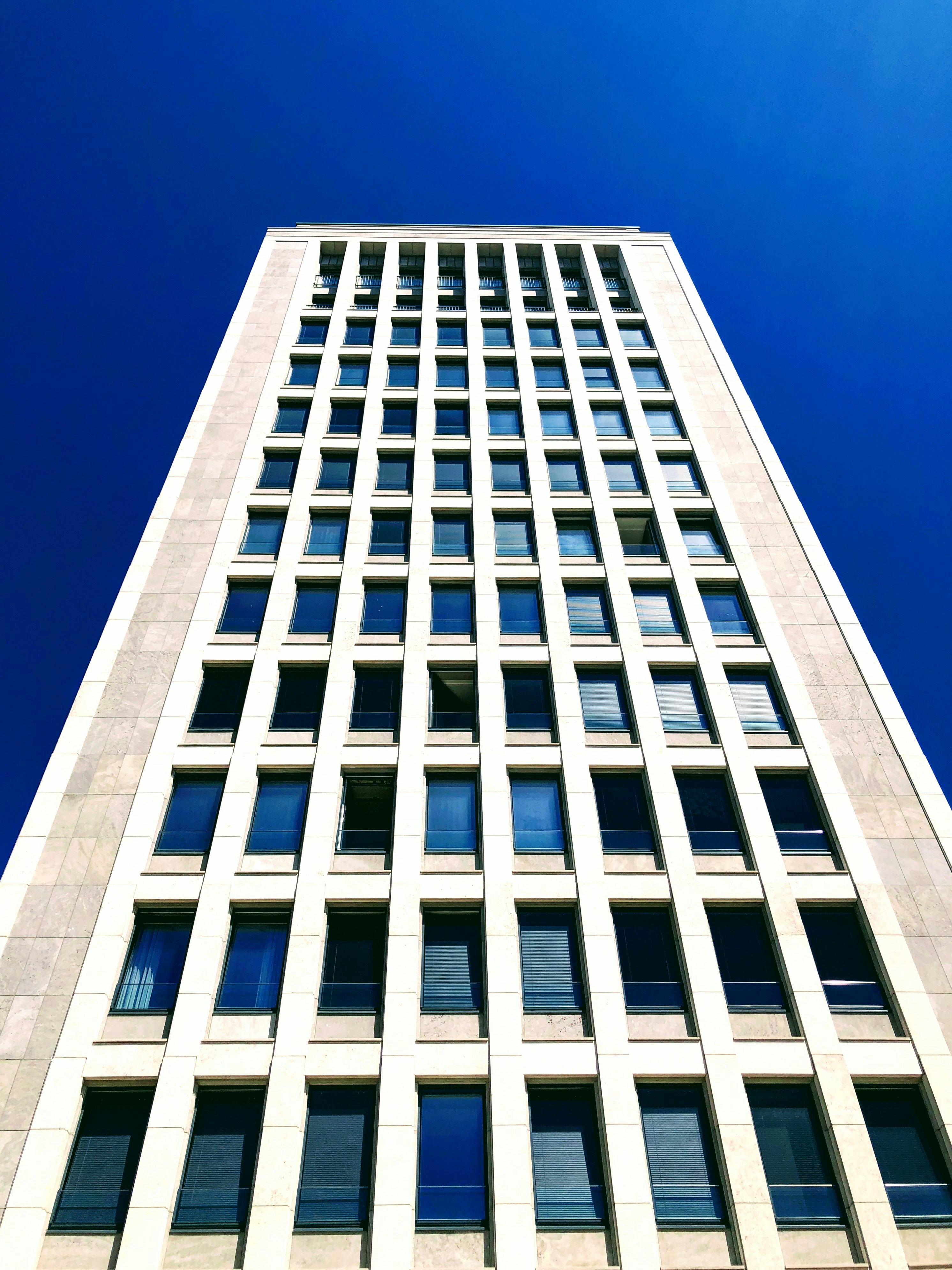 Gridscape Tower: A Vertical Facade Reaching Toward the Blue