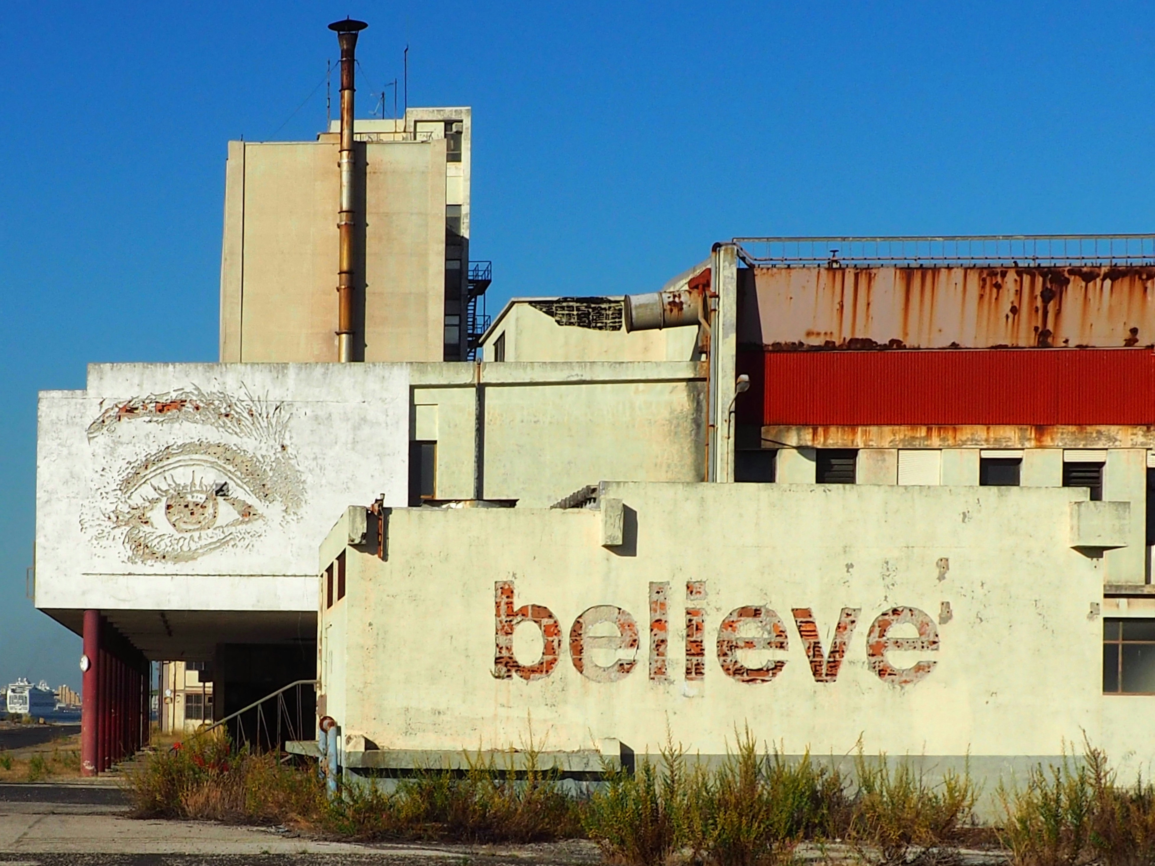Red and yellow Believe wall photo – Free Margueira Image on Unsplash