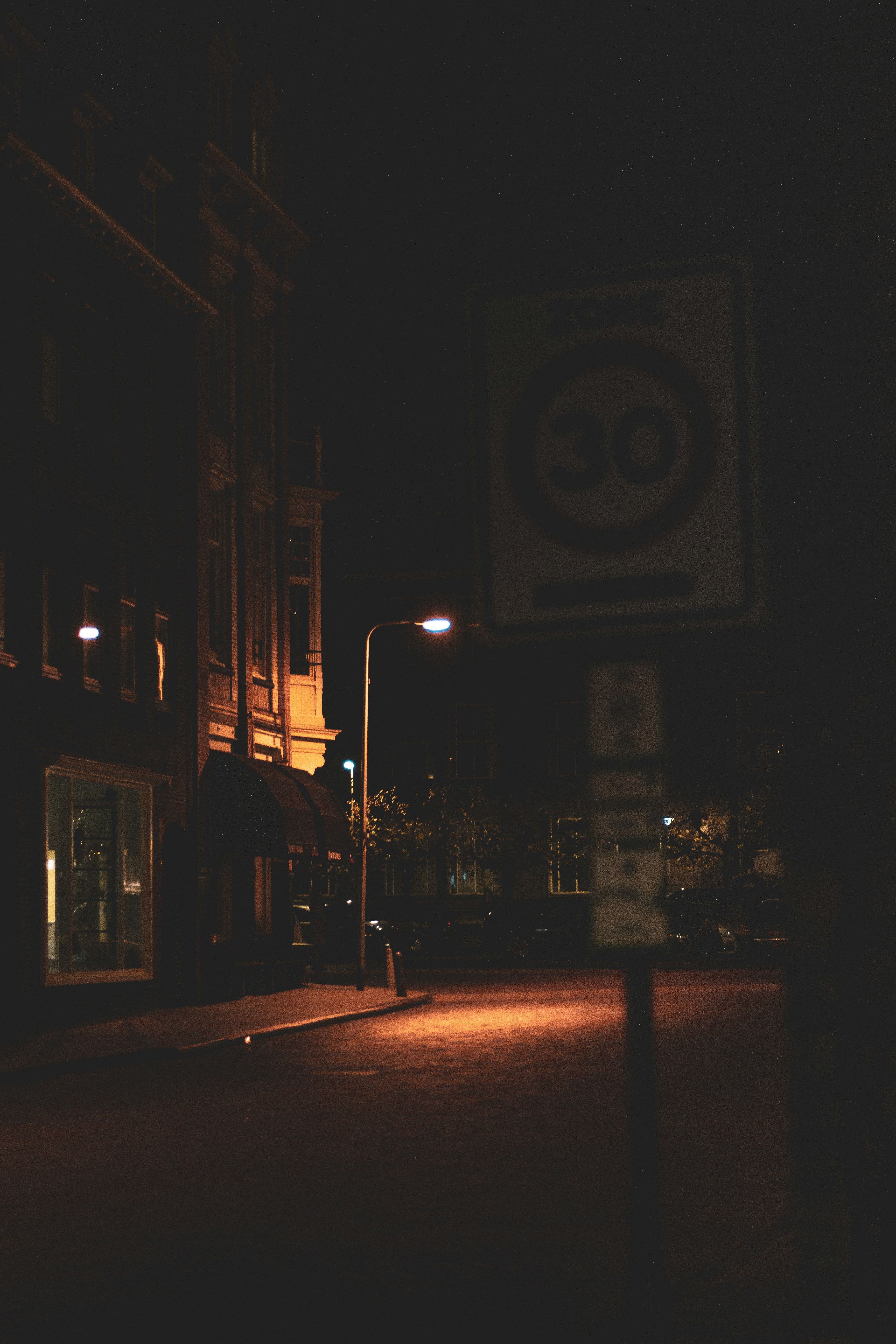 Red and white Zone 30 traffic sign photo – Free Building Image on Unsplash
