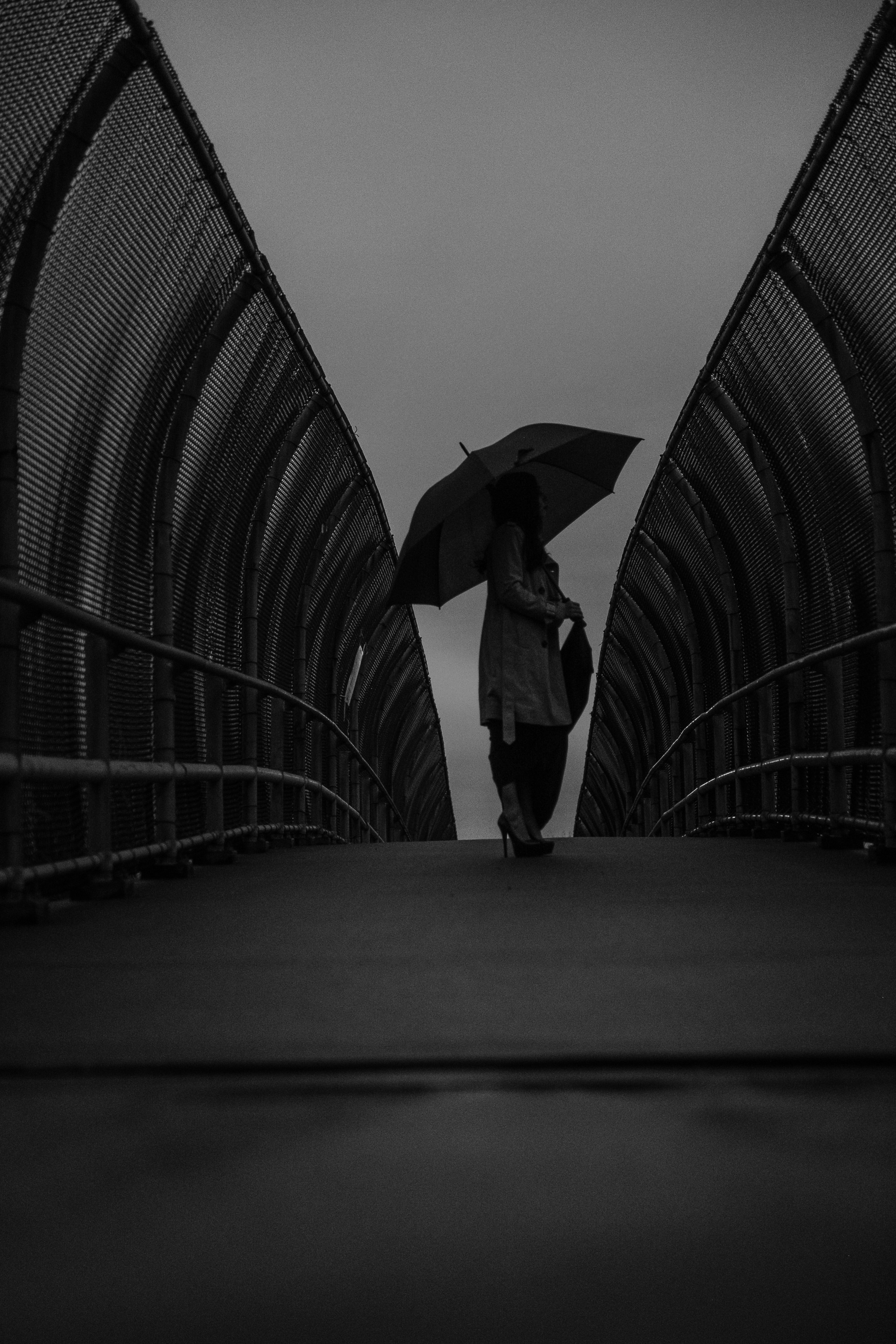 Grayscale photography of woman using umbrella while standing on pathway photo – Free Grey Image ...