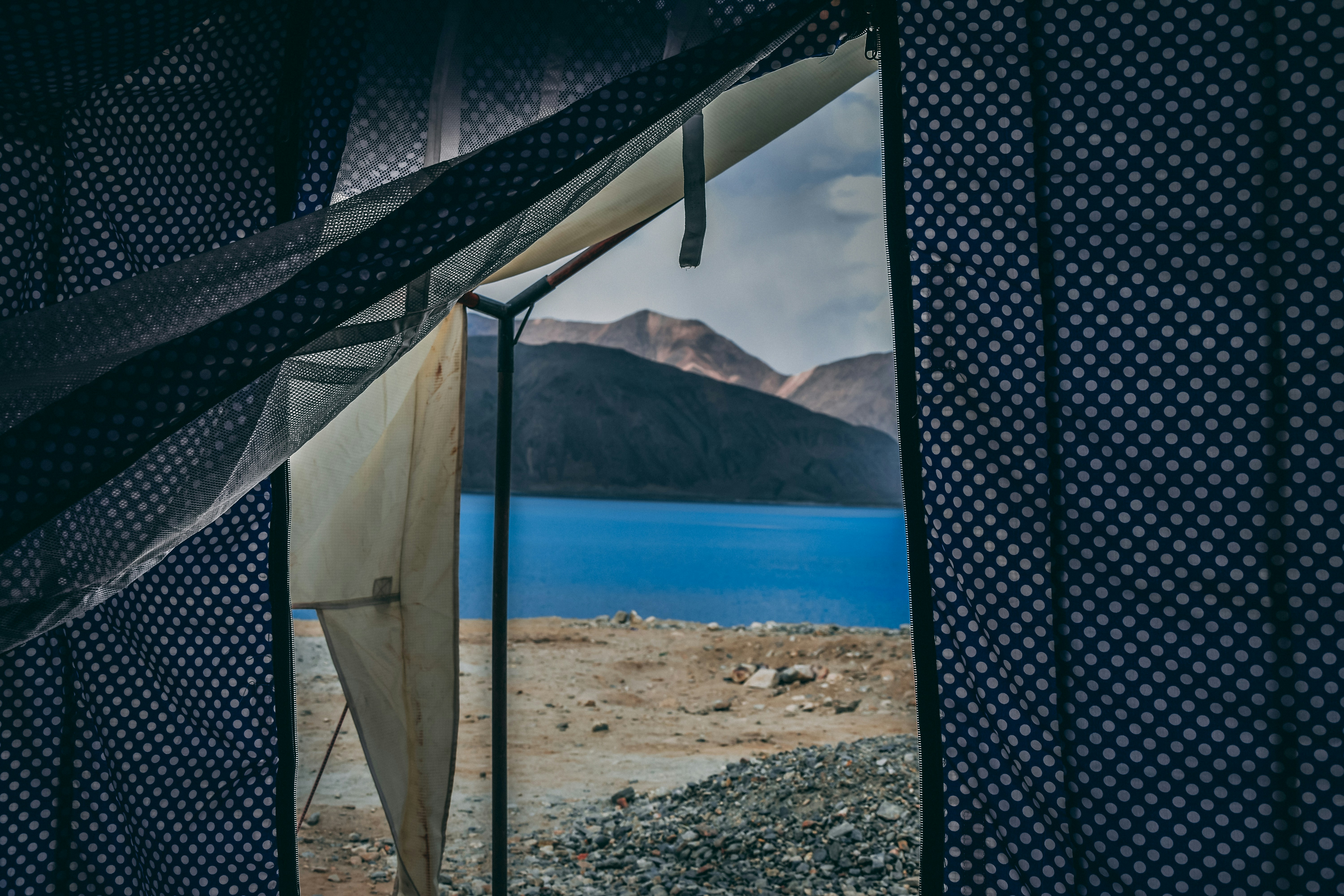 Through the Tent Door: Turquoise Lake Framed by Alpine Peaks