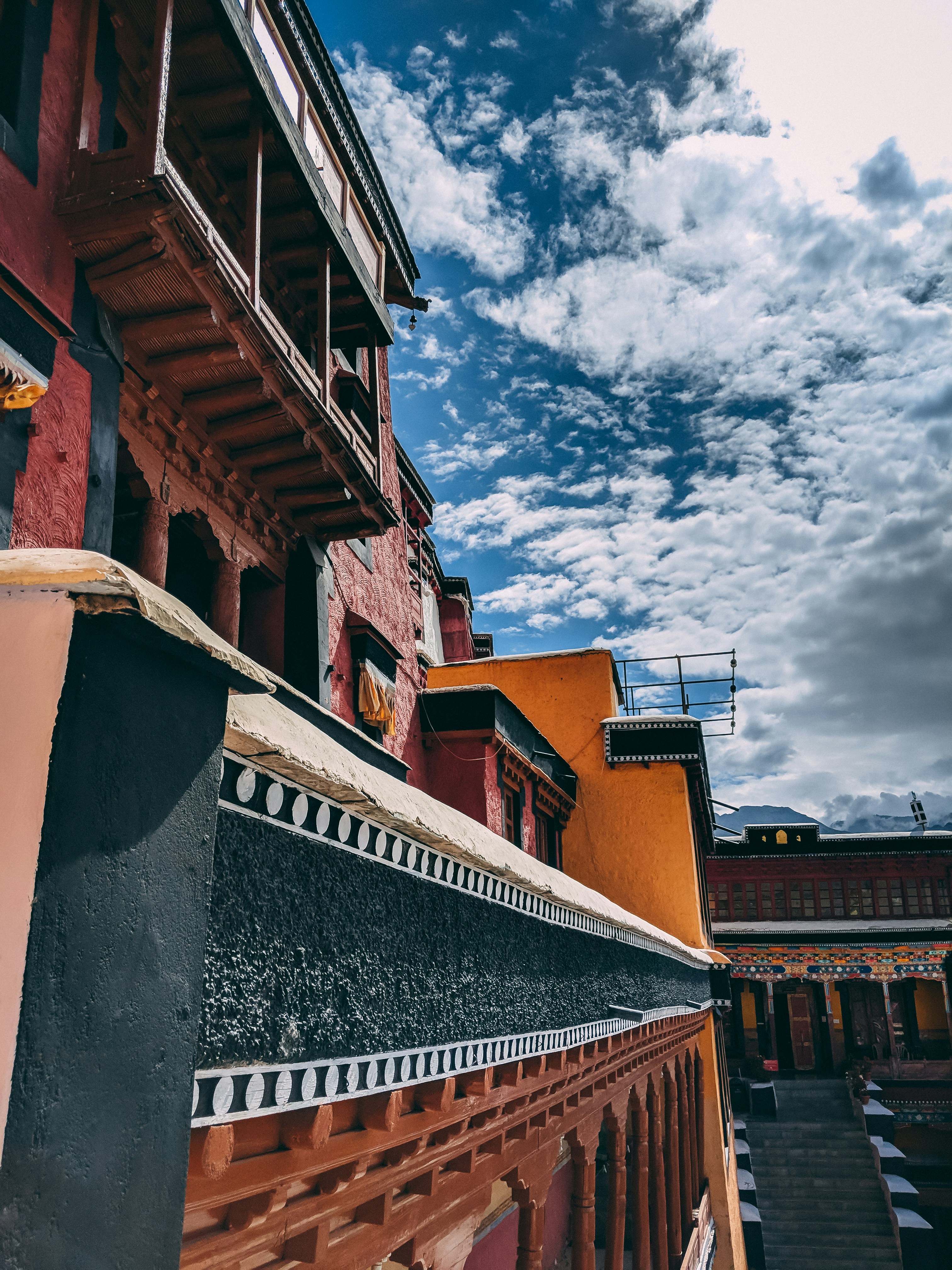 Brown and maroon concrete multi-story building during daytime photo ...