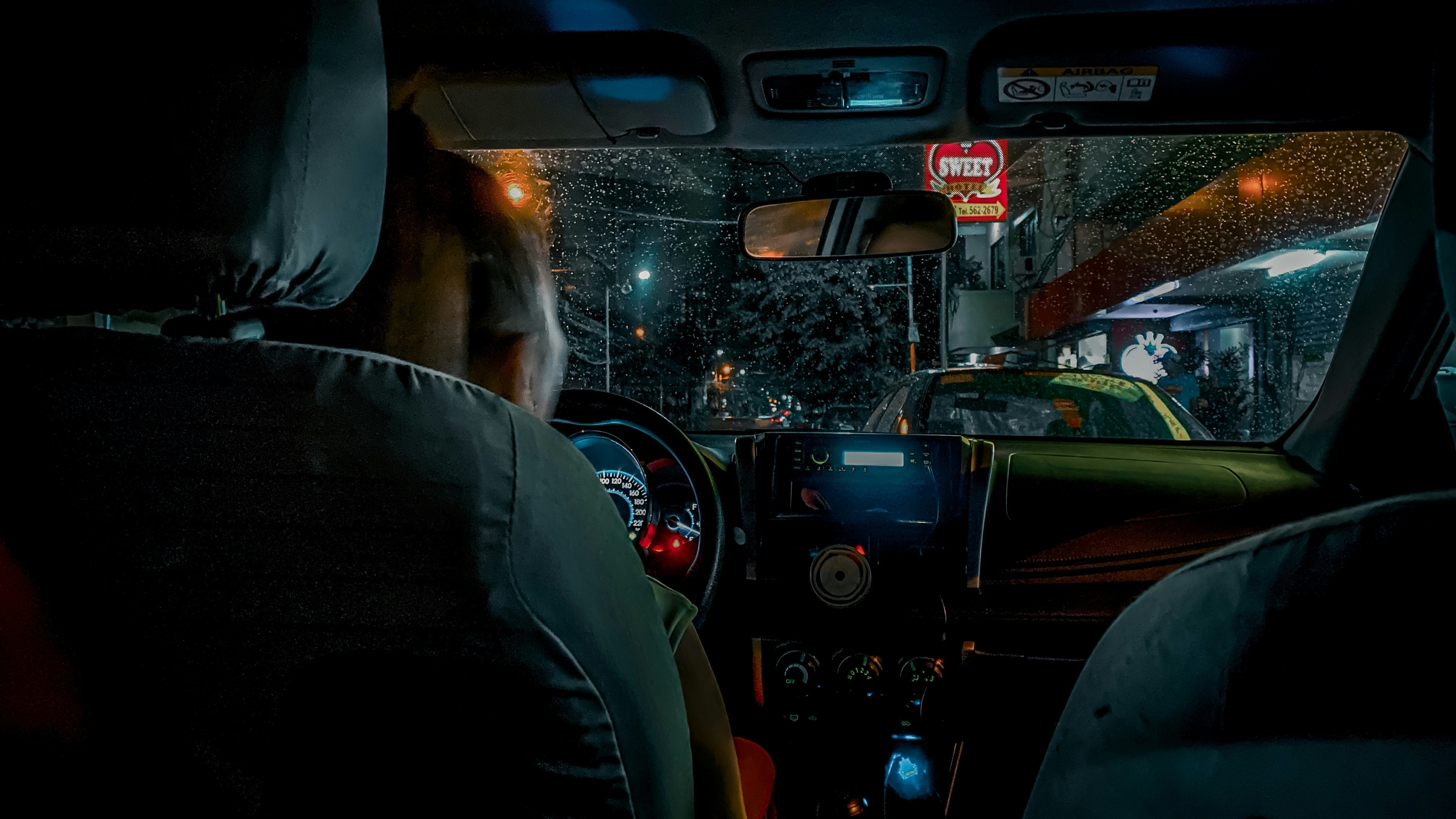 Shallow focus photo of person driving car during nighttime photo – Free ...