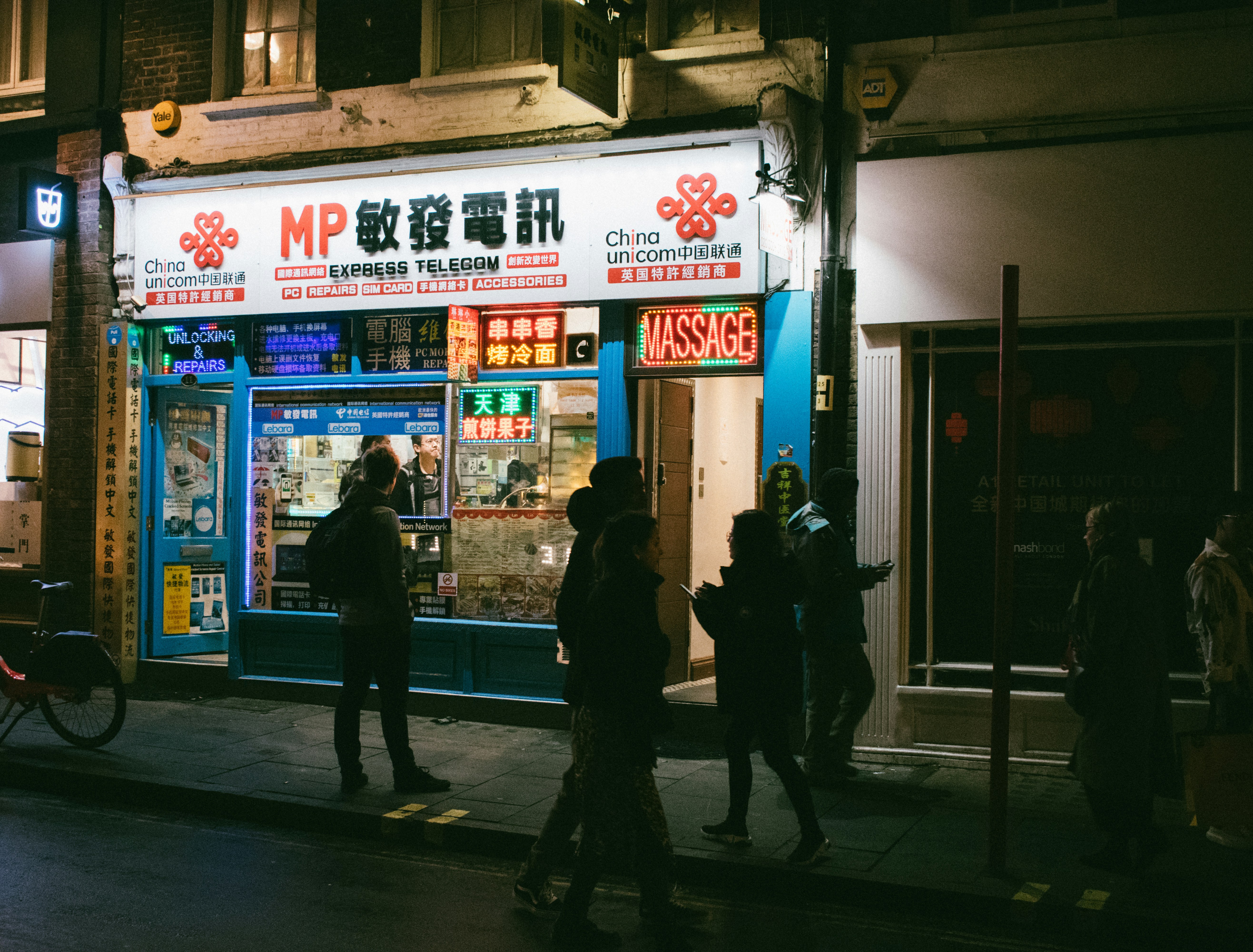 Evening Stroll Past Neon FacadesSebastian Grochowicz