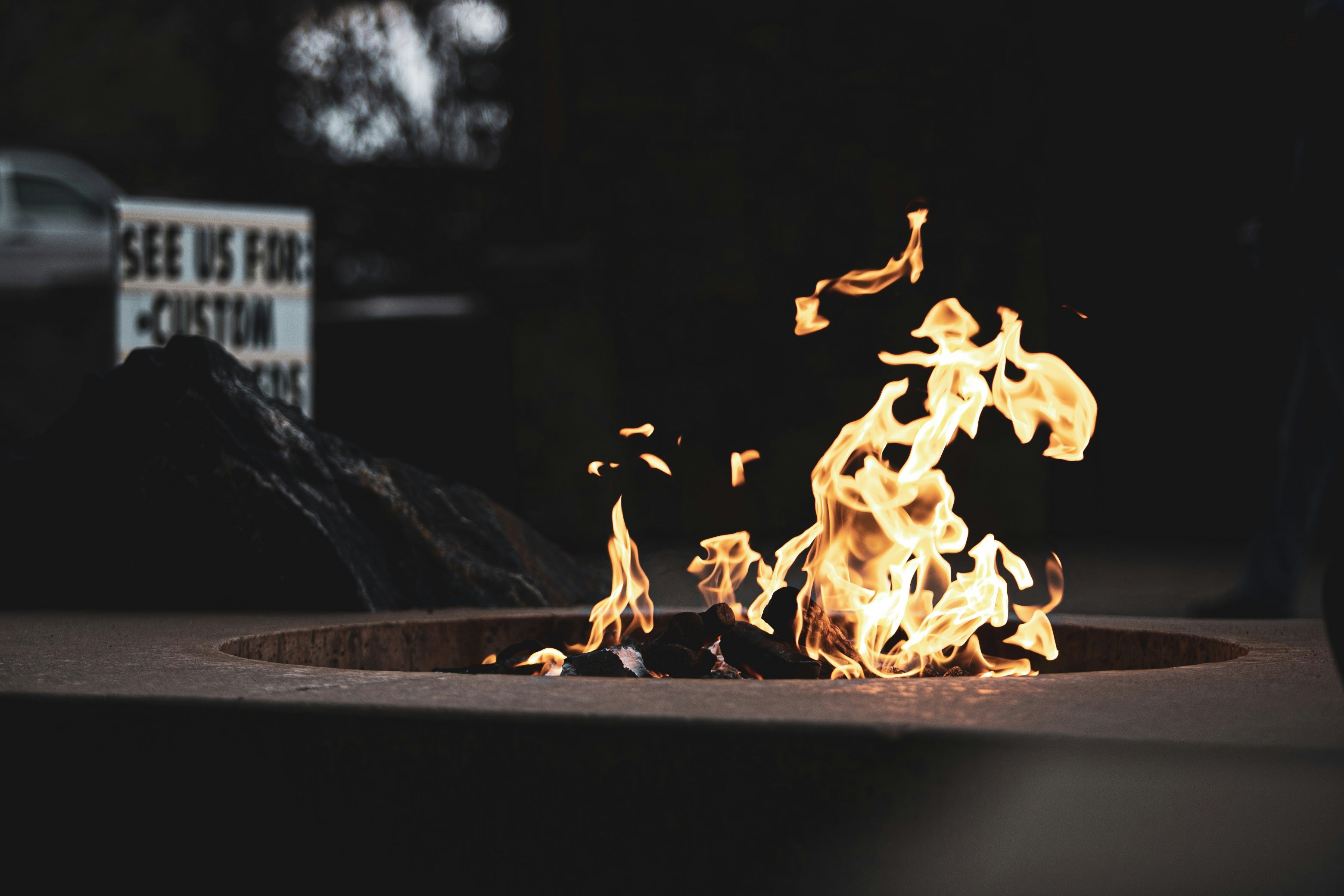 Midnight Ember Crown: Flames Ring a Circular Fire Pit