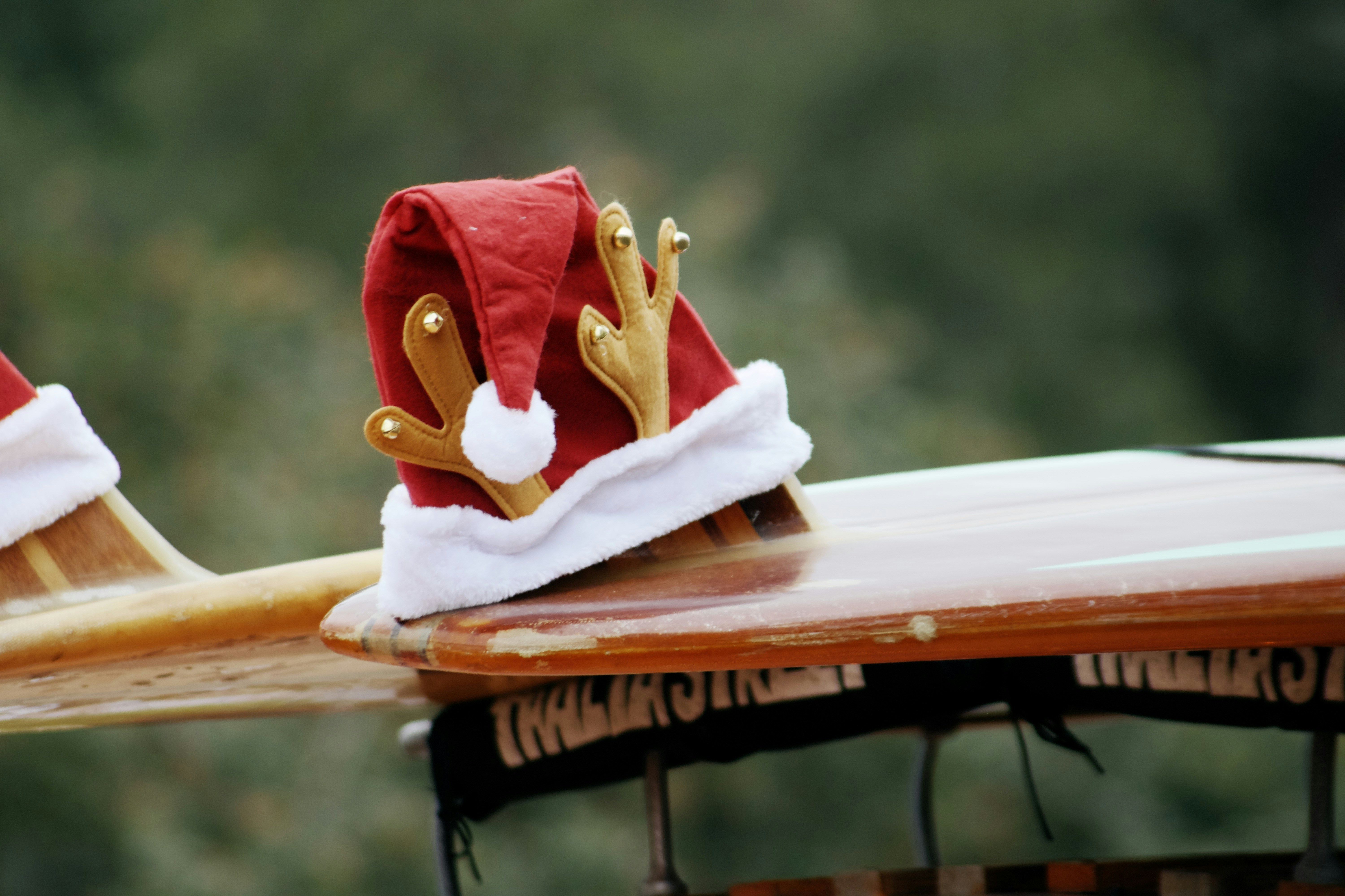 Santa Boots on a Carved Rooftop: A Festive Moment in Flight