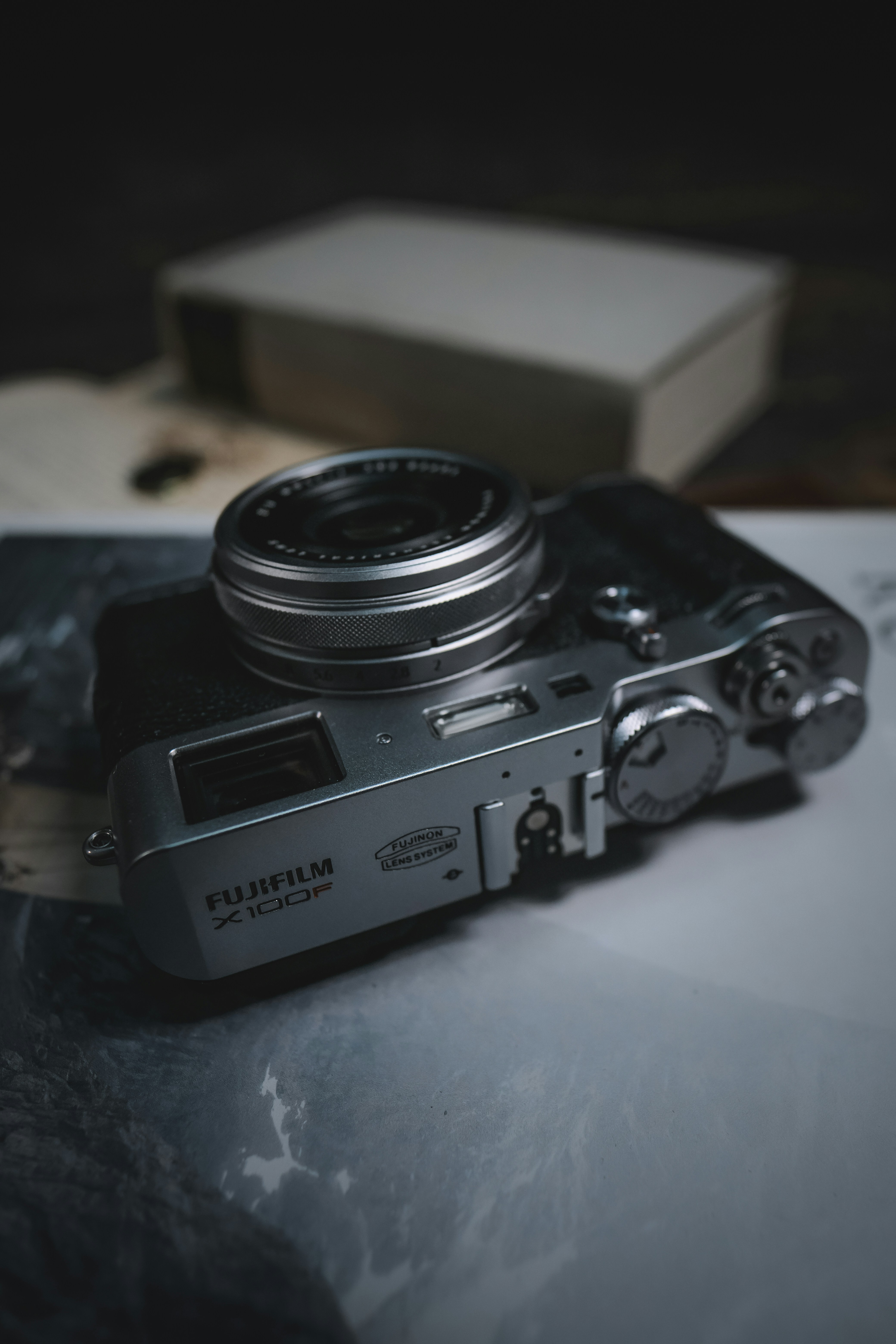 Silver Classic: Fujifilm X-T3 Resting on a Weathered Surface