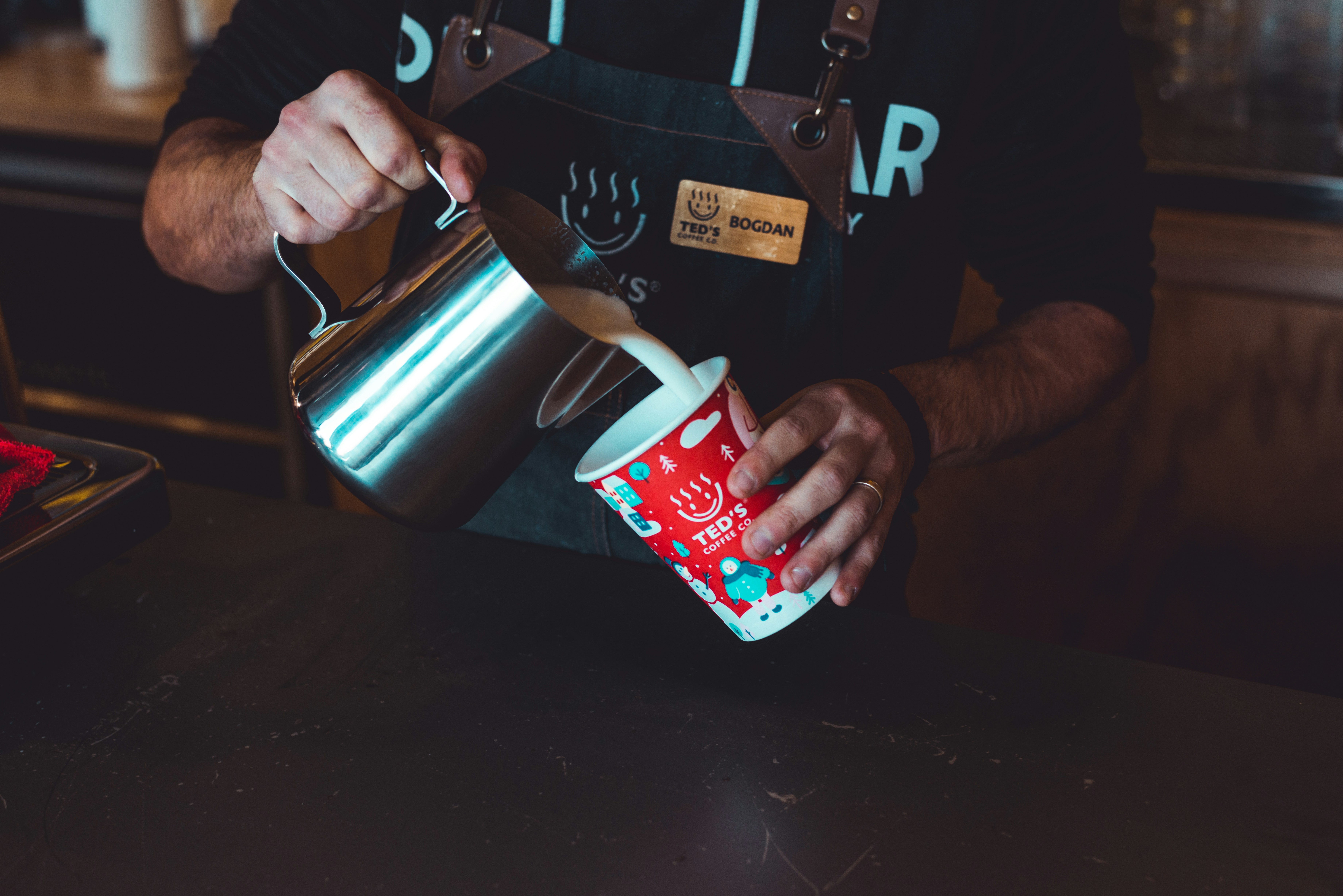 Barista’s Pour: Steam, Cup, and Craft on a Dark Counter