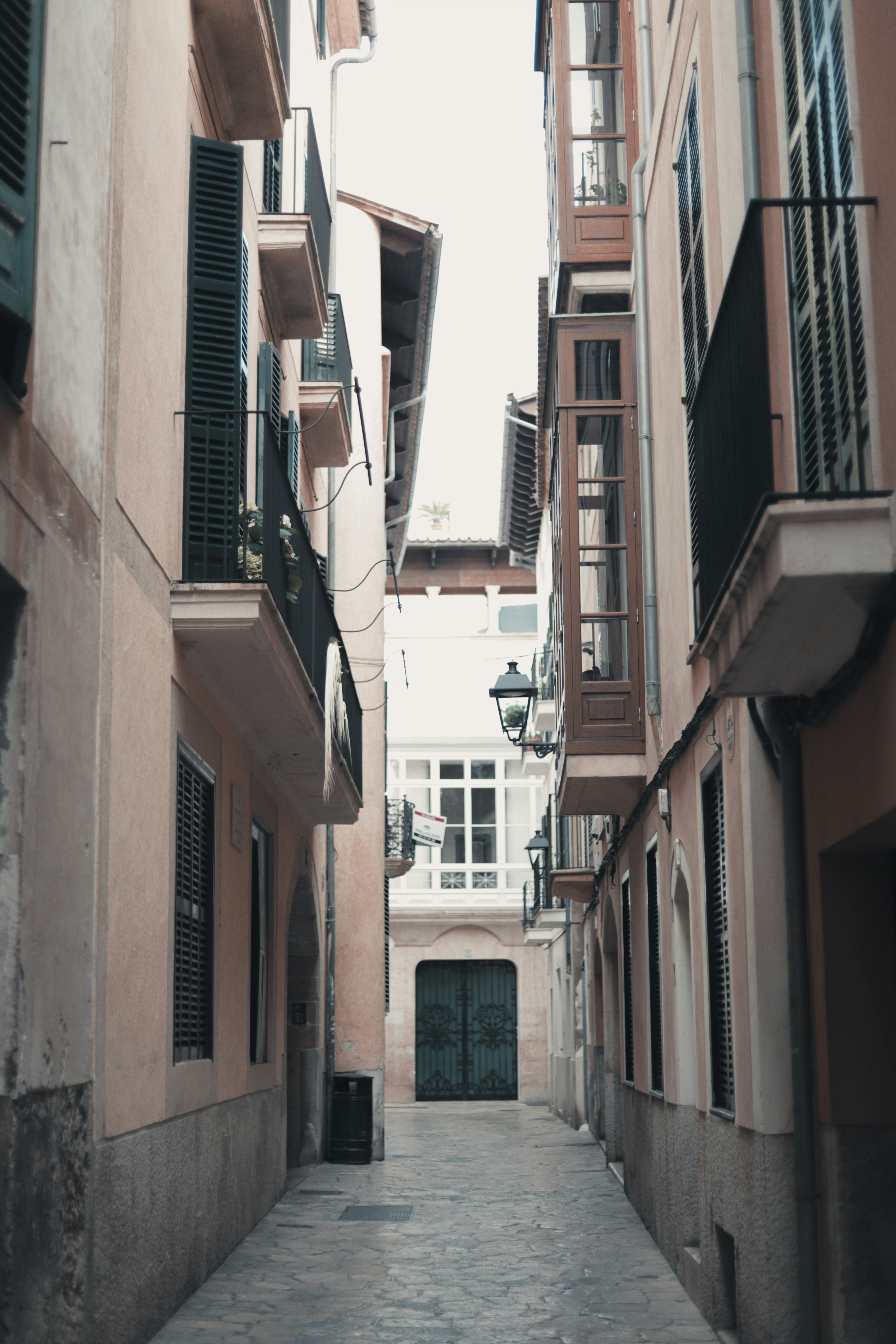 Gray alley between concrete buildings photo – Free Brown Image on Unsplash