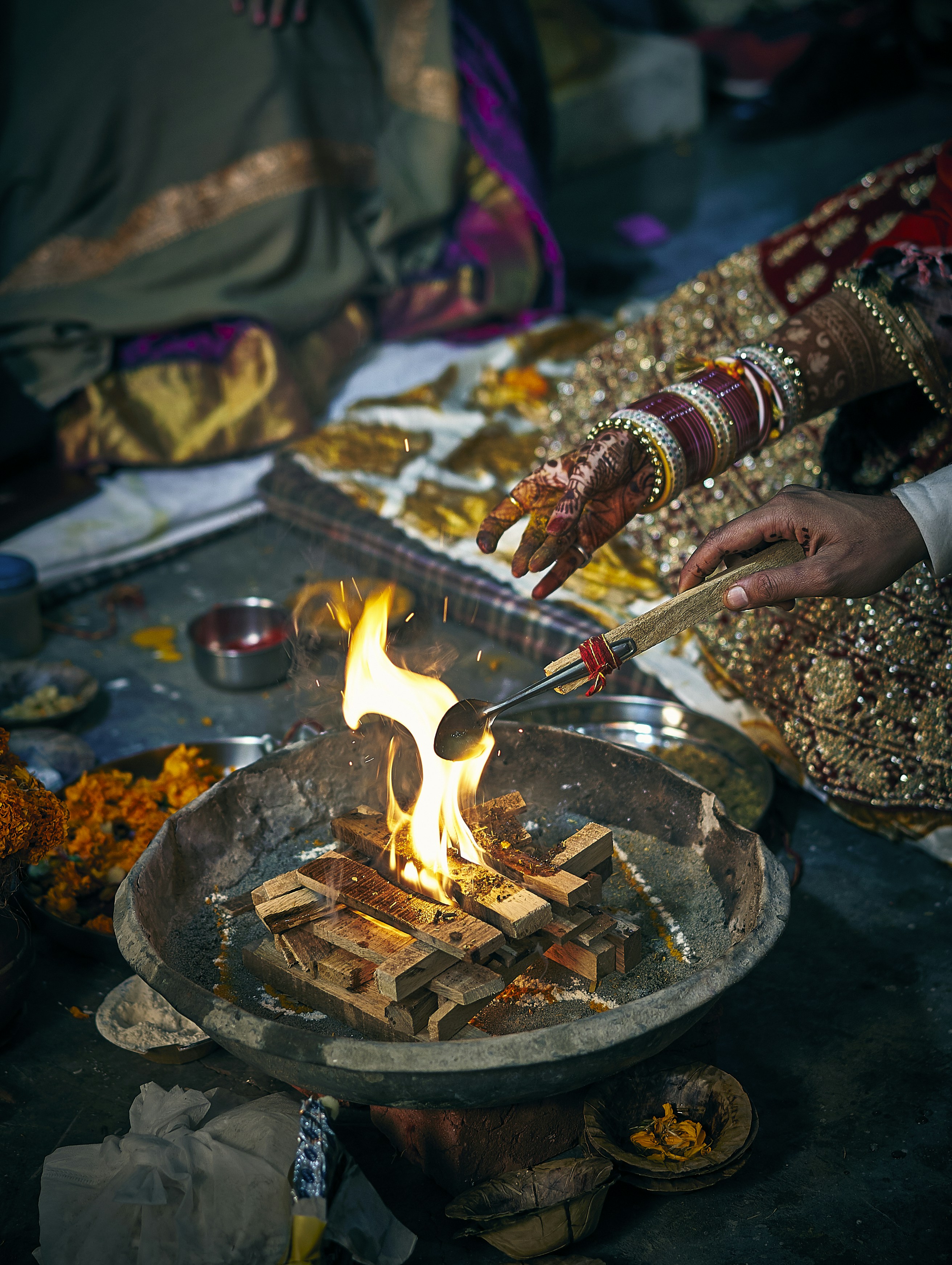A woman is lighting a fire in a bowl photo – Free Food Image on Unsplash
