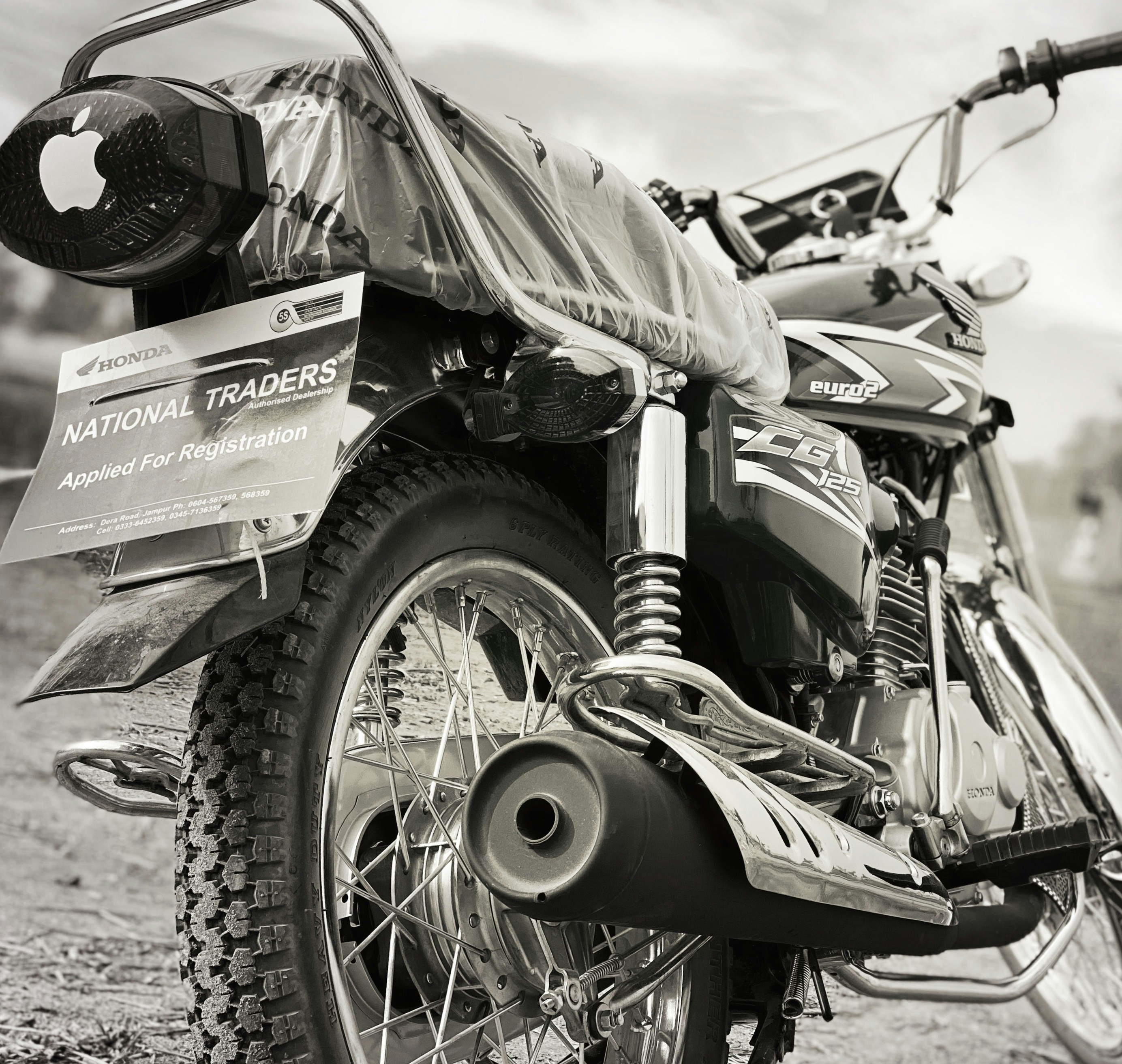Classic Honda off-road motorcycle in monochrome focus