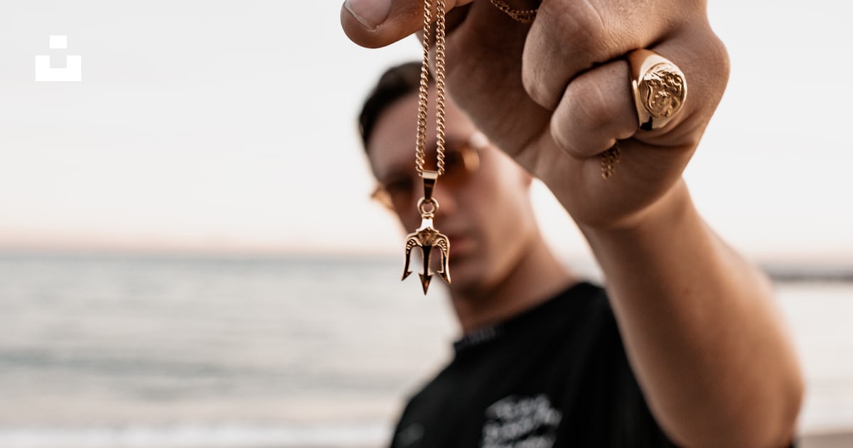 Person Holding Gold Colored Chain Link Necklace Photo Free Human