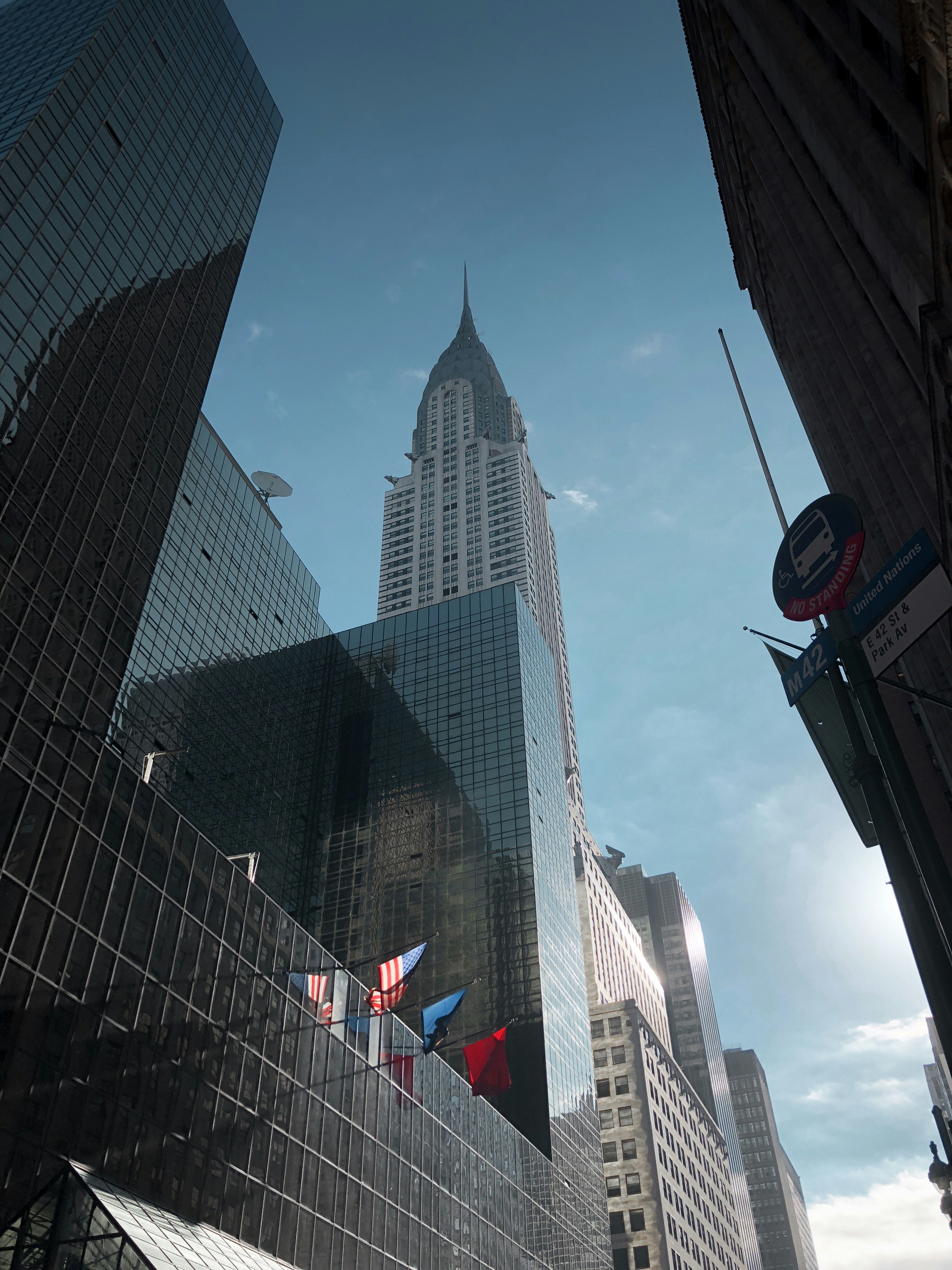 Spire Piercing the Glass Canopy: Street-Level NYC Geometry