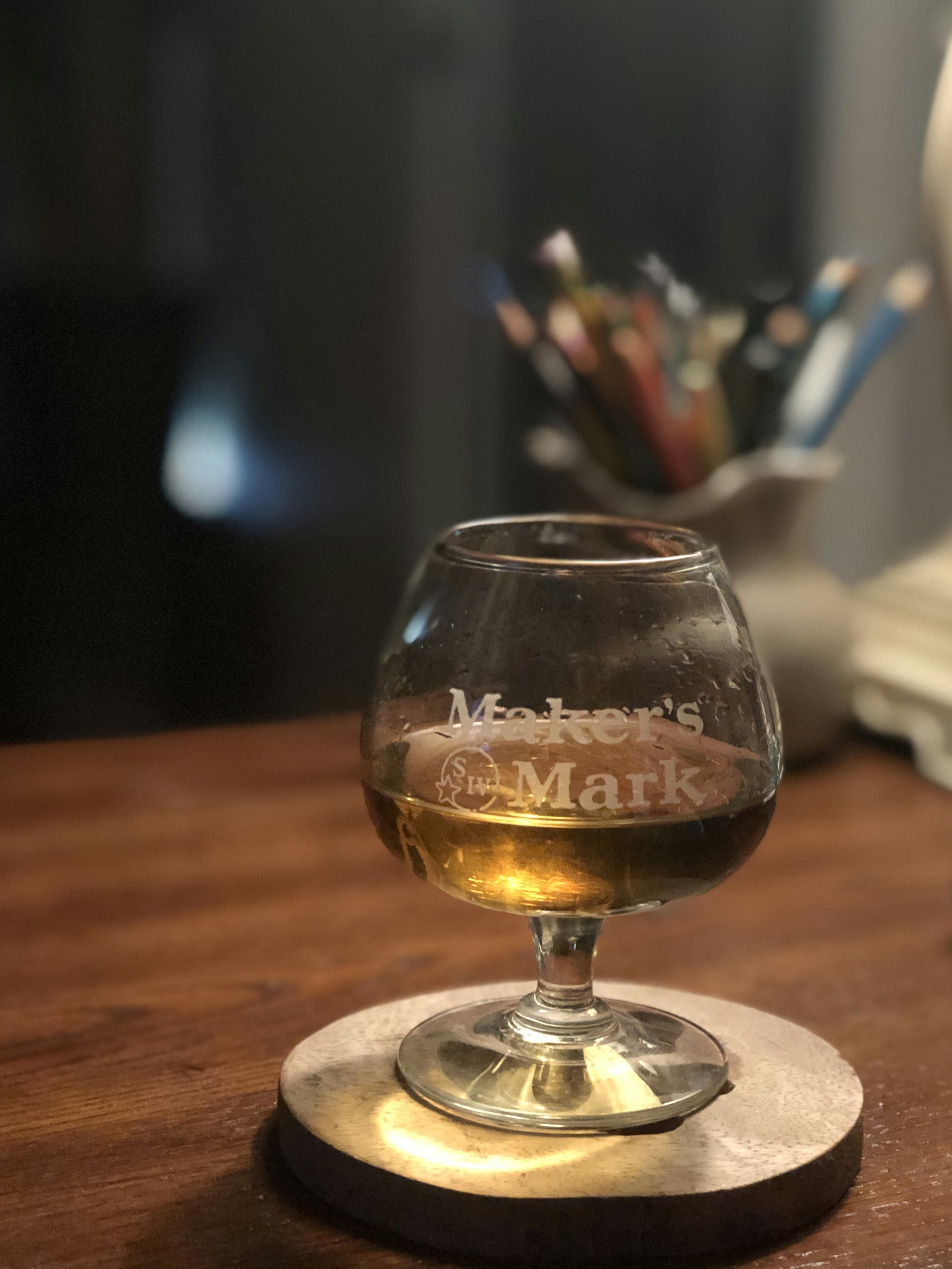 Amber Focus: Quiet Moment with a Maker's Mark Snifter on Wood