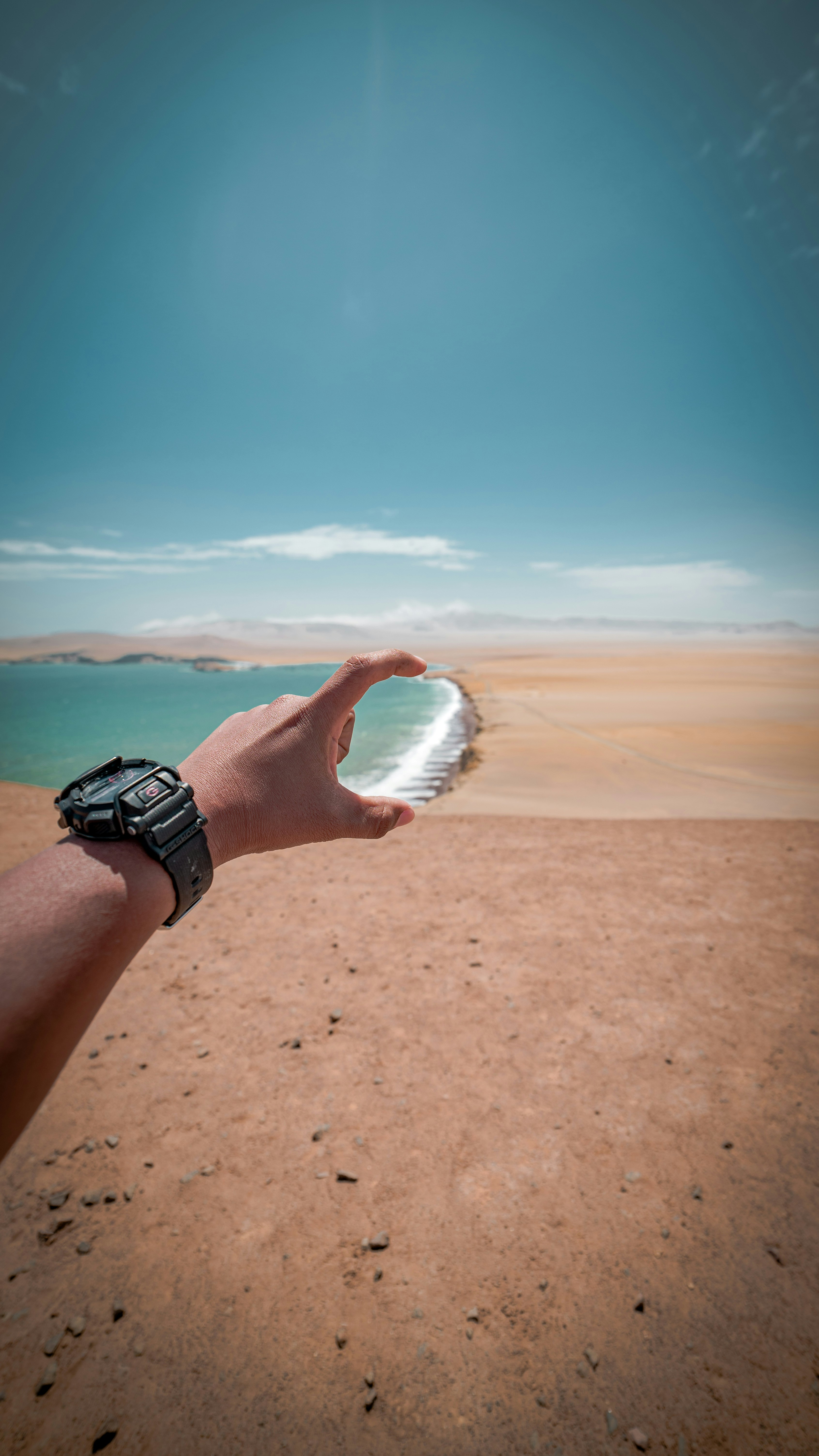 Stretching Horizon: A Hand Reaches Toward the Sea of Dunes