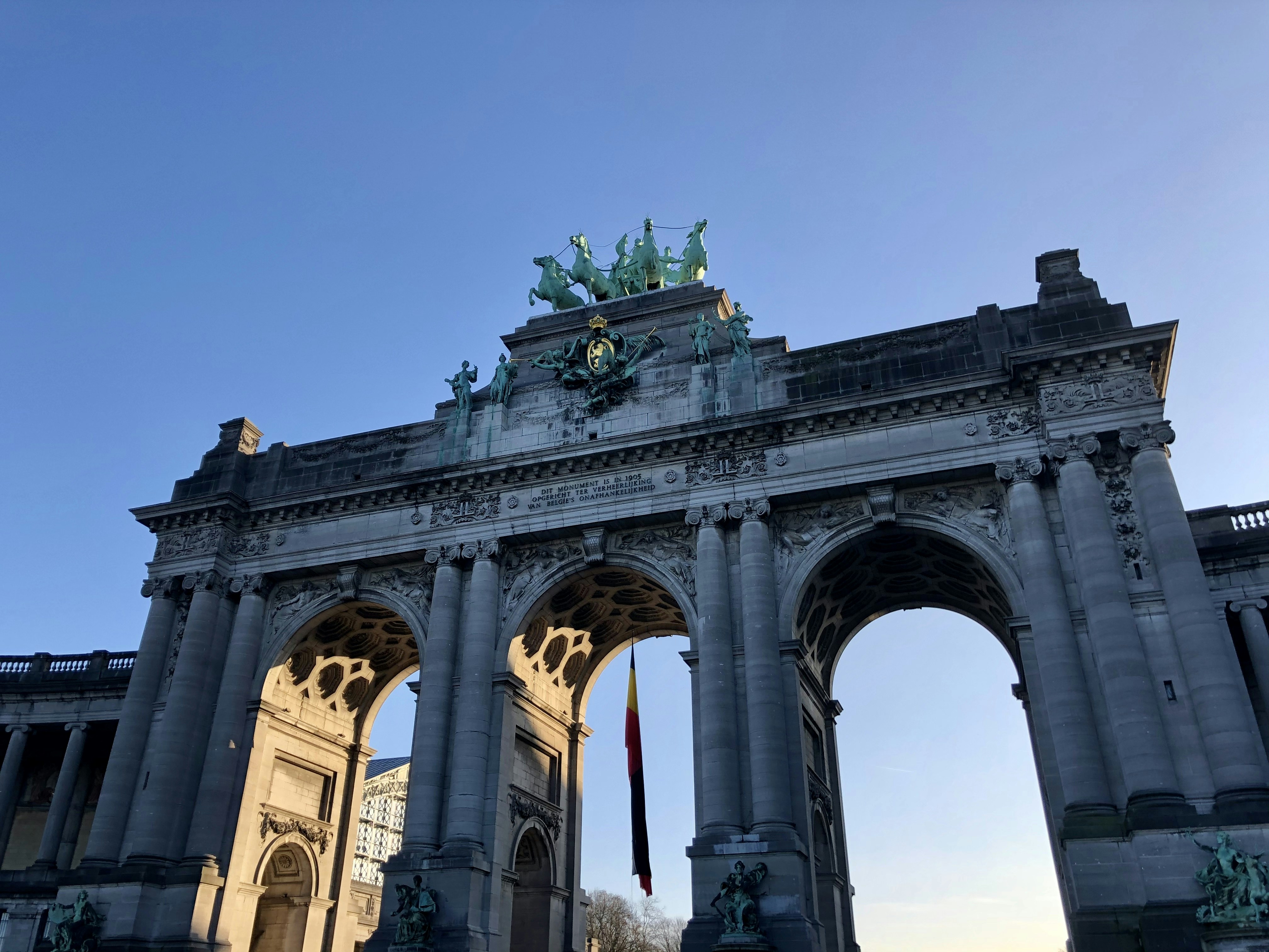 gray 3-entrance gate during day