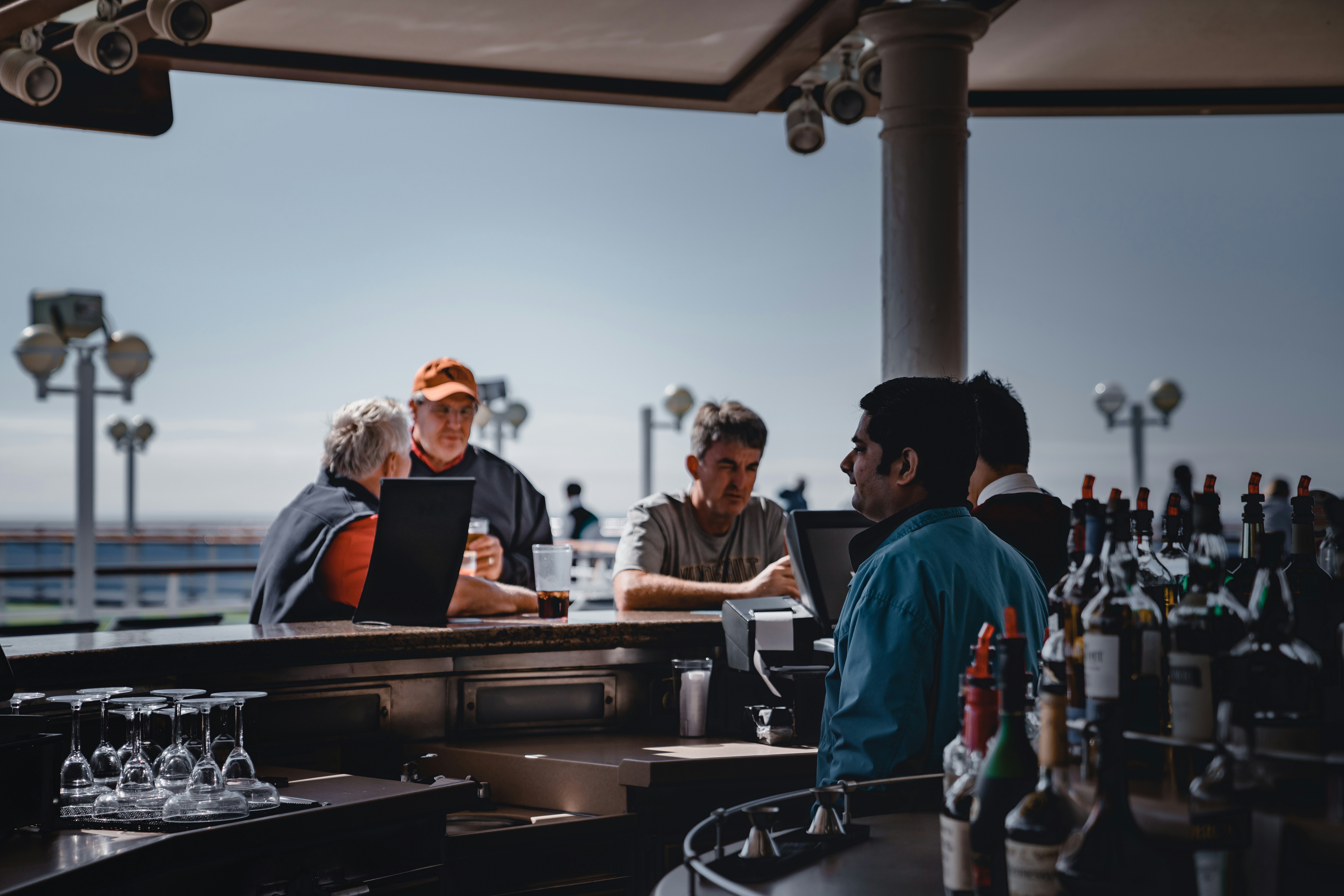 Men in front of bar counter during daytime photo – Free Grey Image on ...
