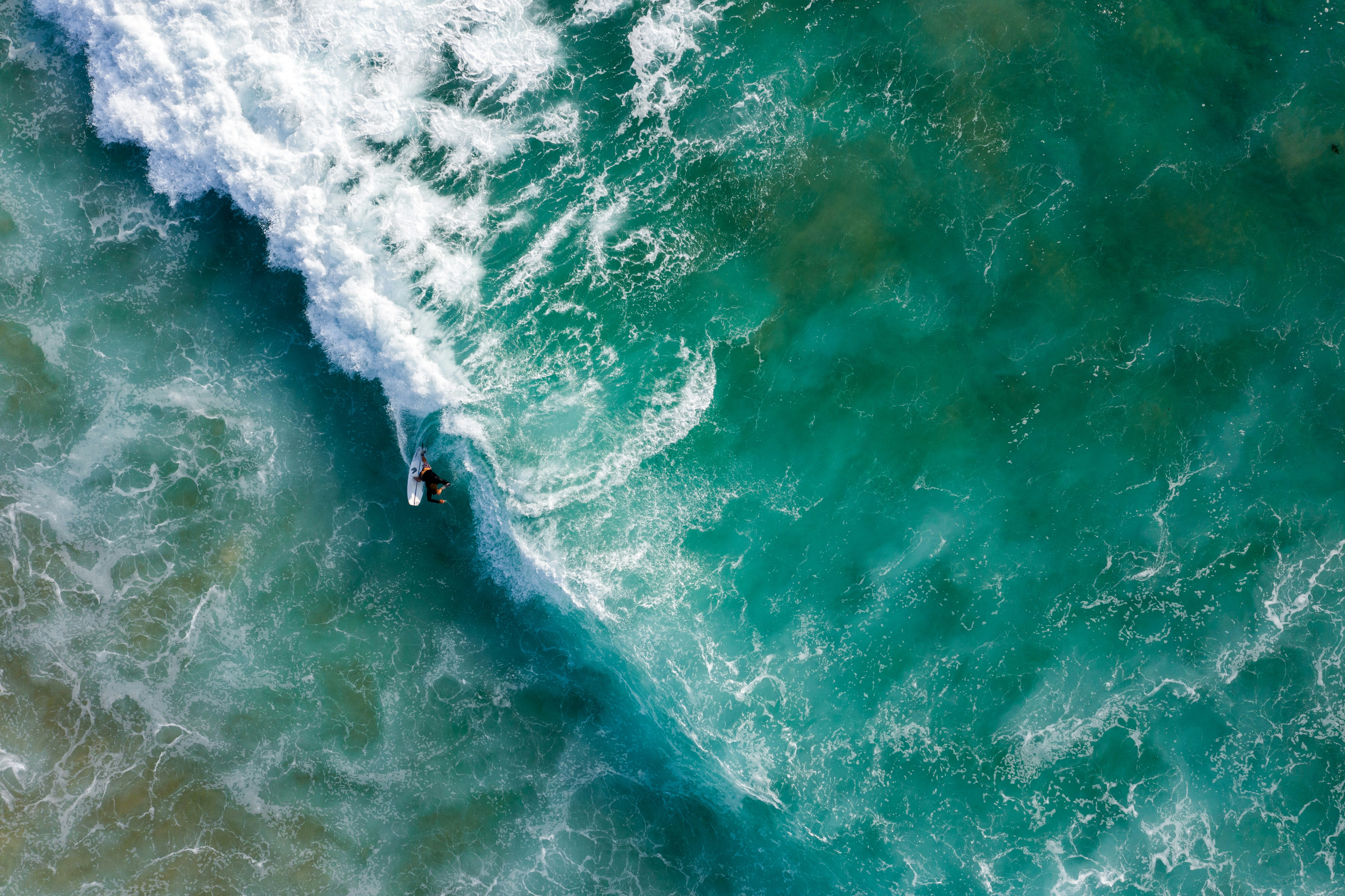 Aerial photography of person surfboarding photo – Free Blue Image on ...