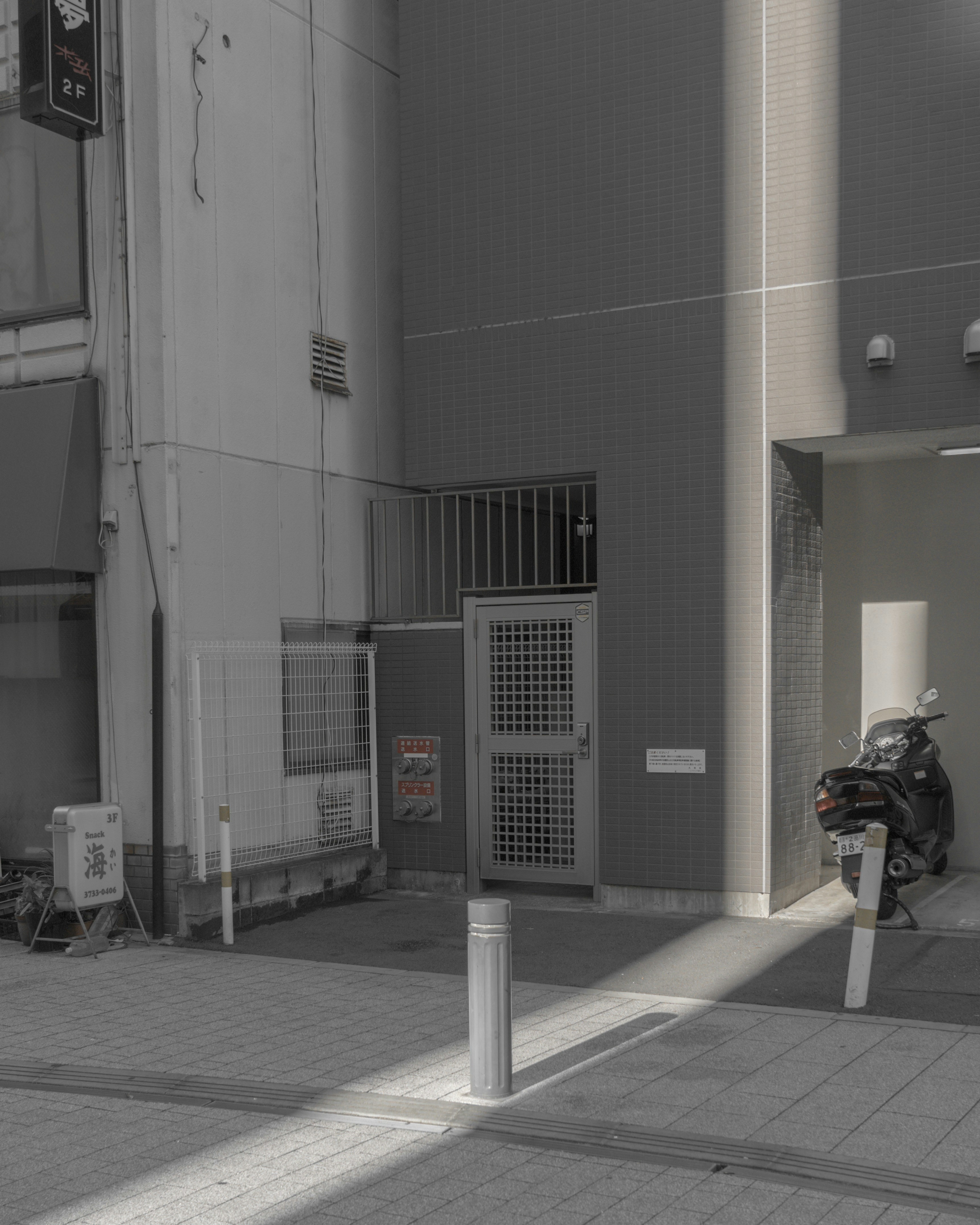 Parked motorcycle beside gate photo – Free Grey Image on Unsplash