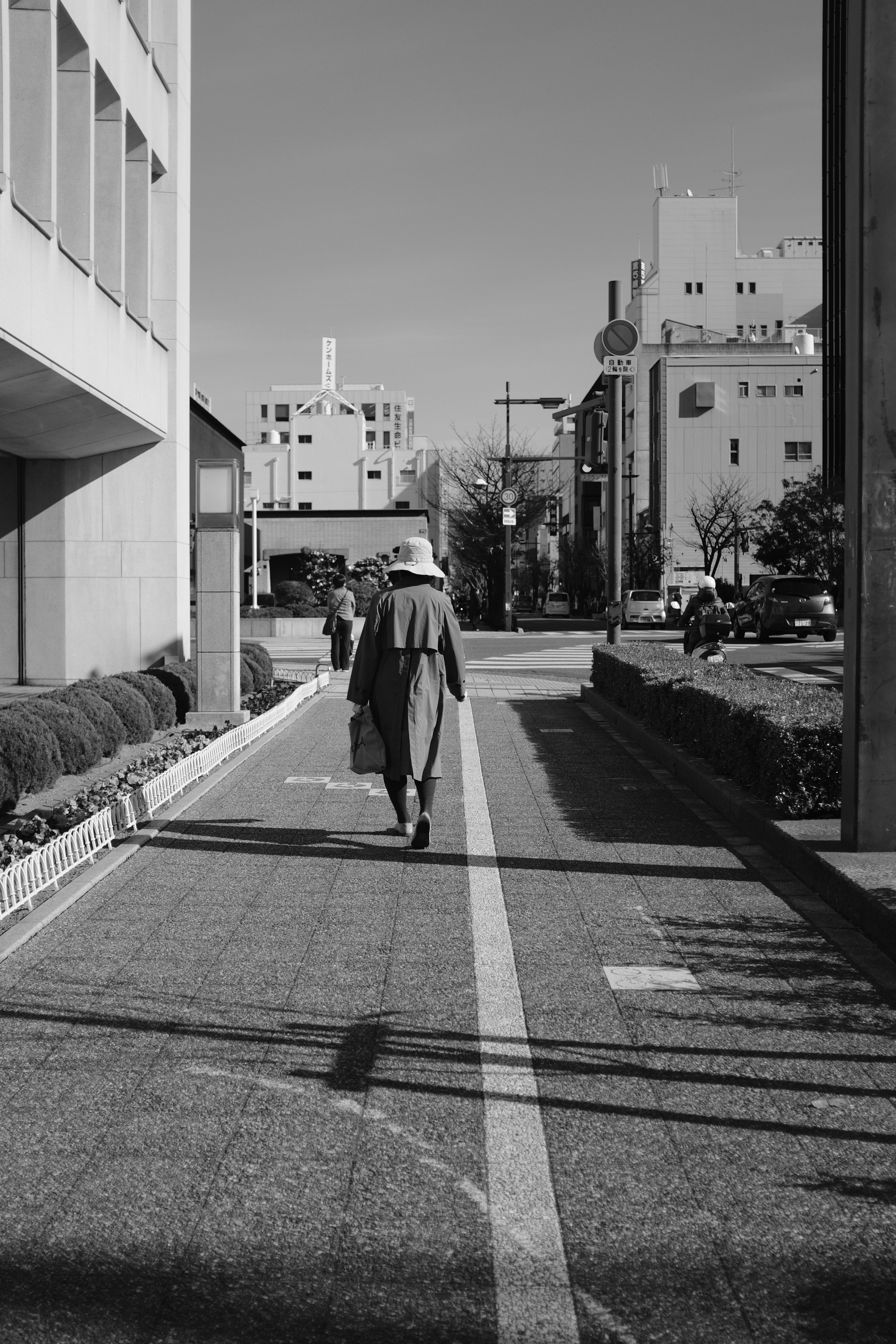 Woman walking near building during daytime photo – Free Grey Image on ...