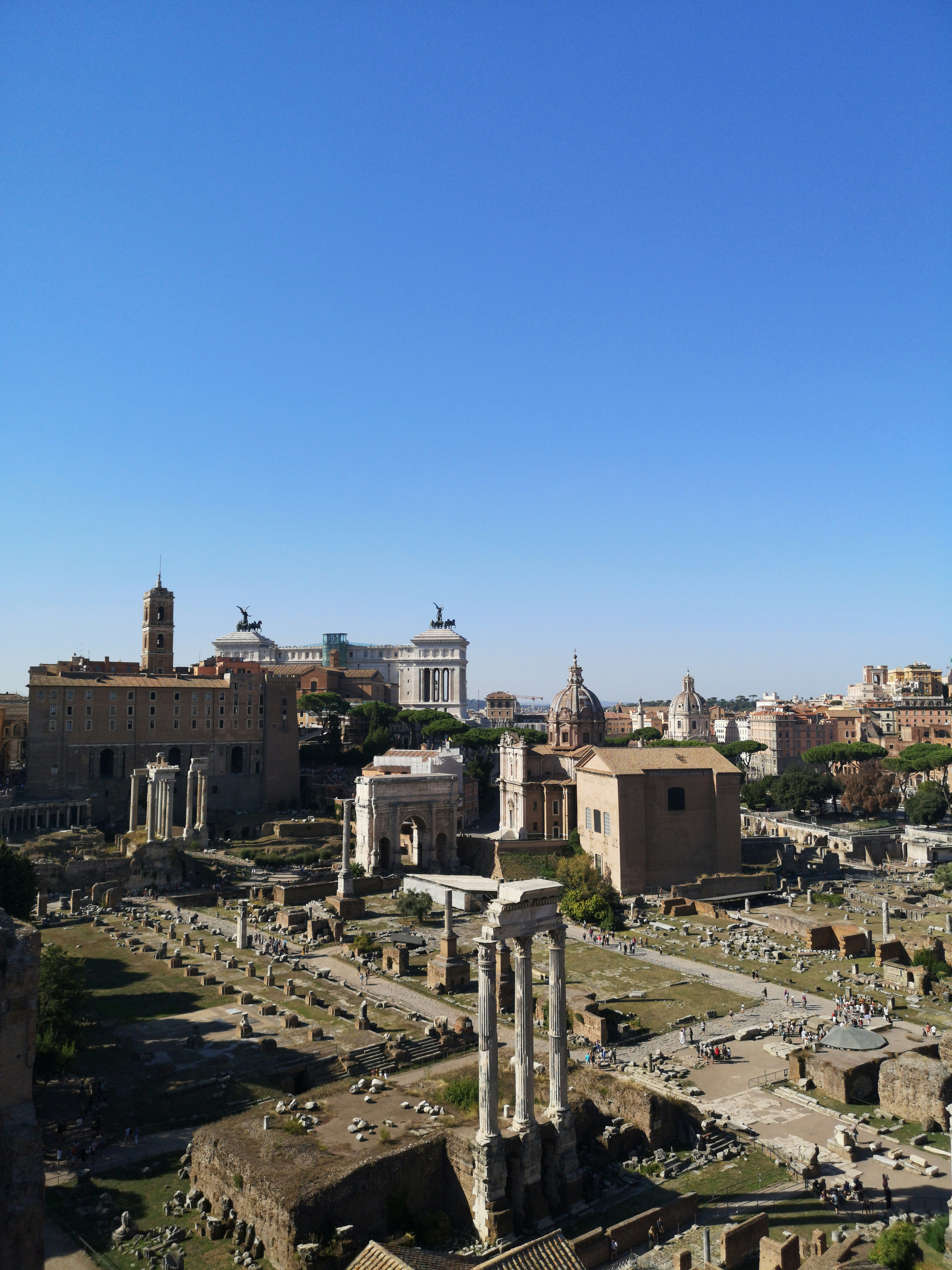 Echoes of Rome: Sunlit Ruins Framing a Quiet City Skyline