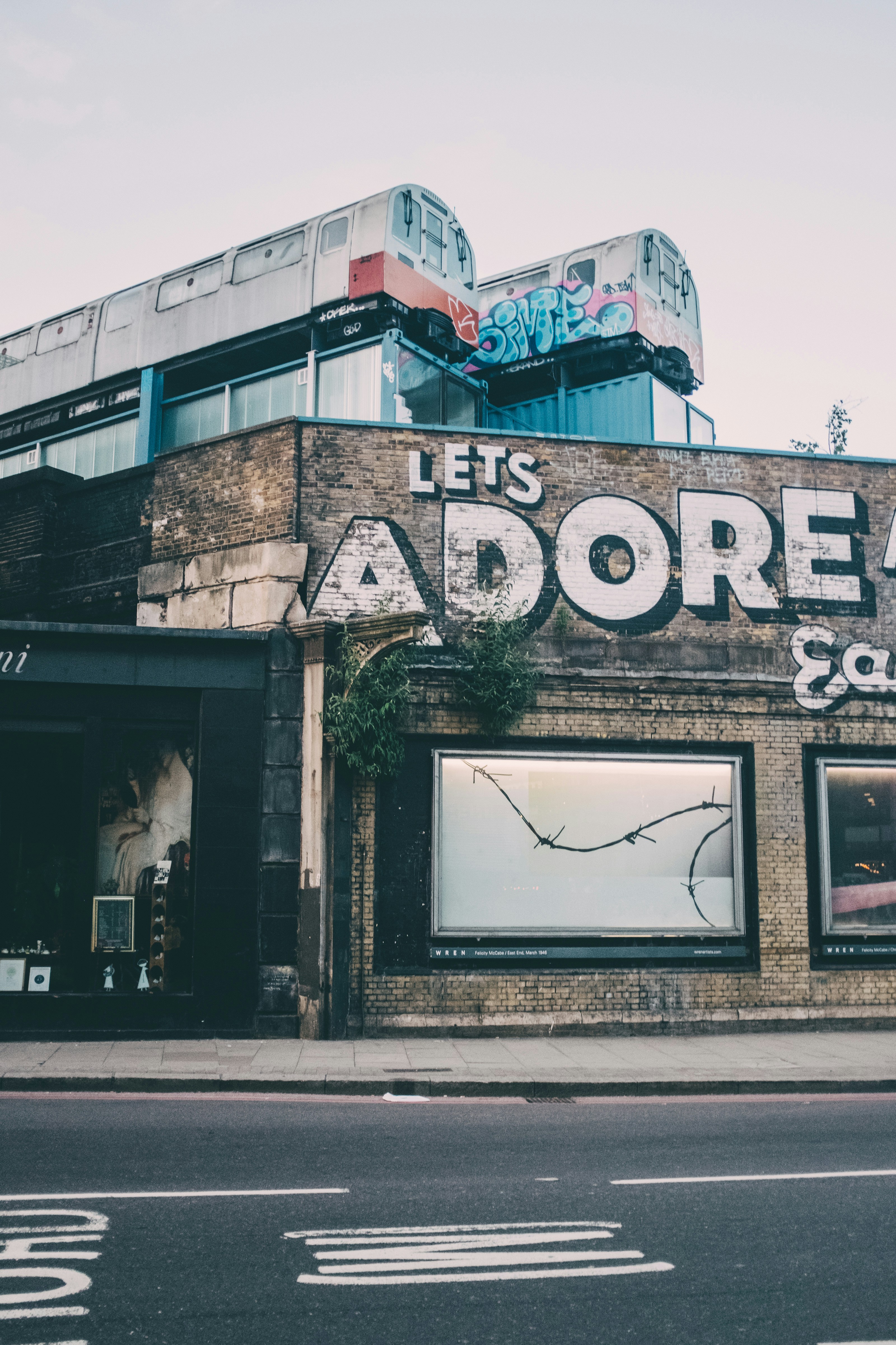 Graffitied Rooftop Above a Wordy Facade