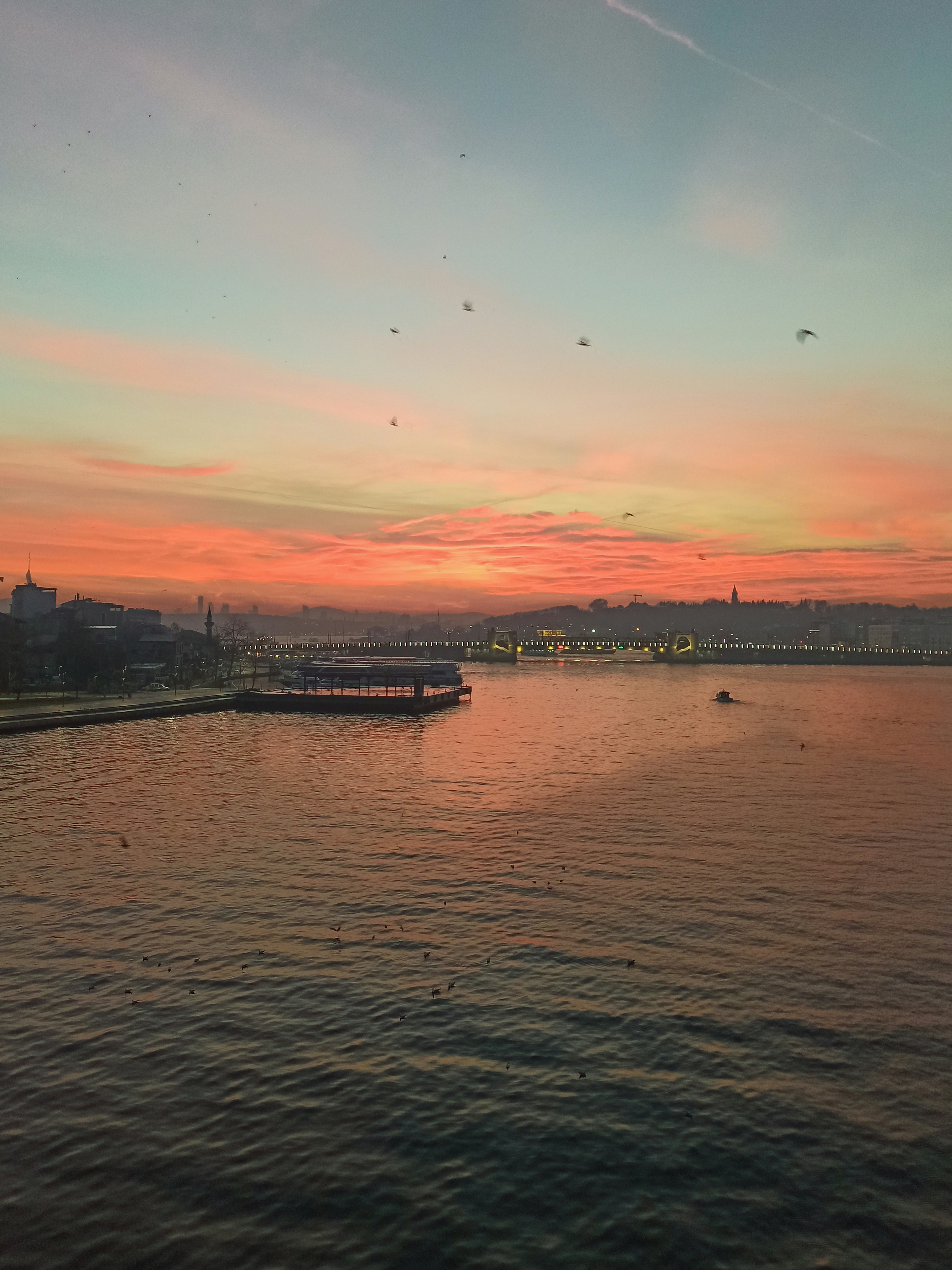 Crimson Horizon Over the River: Distant Bridge in Sunset Light