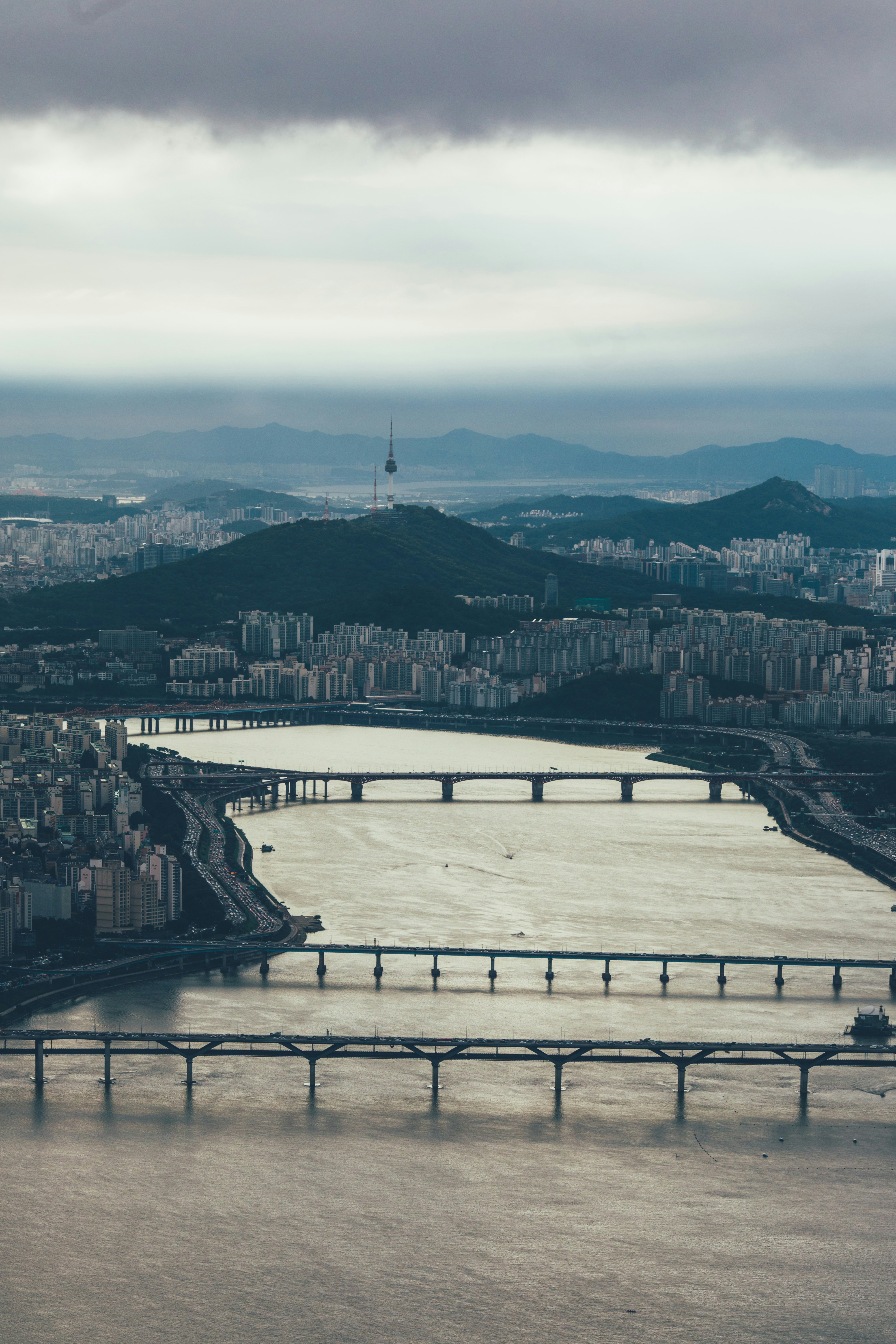 Gray concrete bridges under cloudy sky photo – Free Grey Image on Unsplash