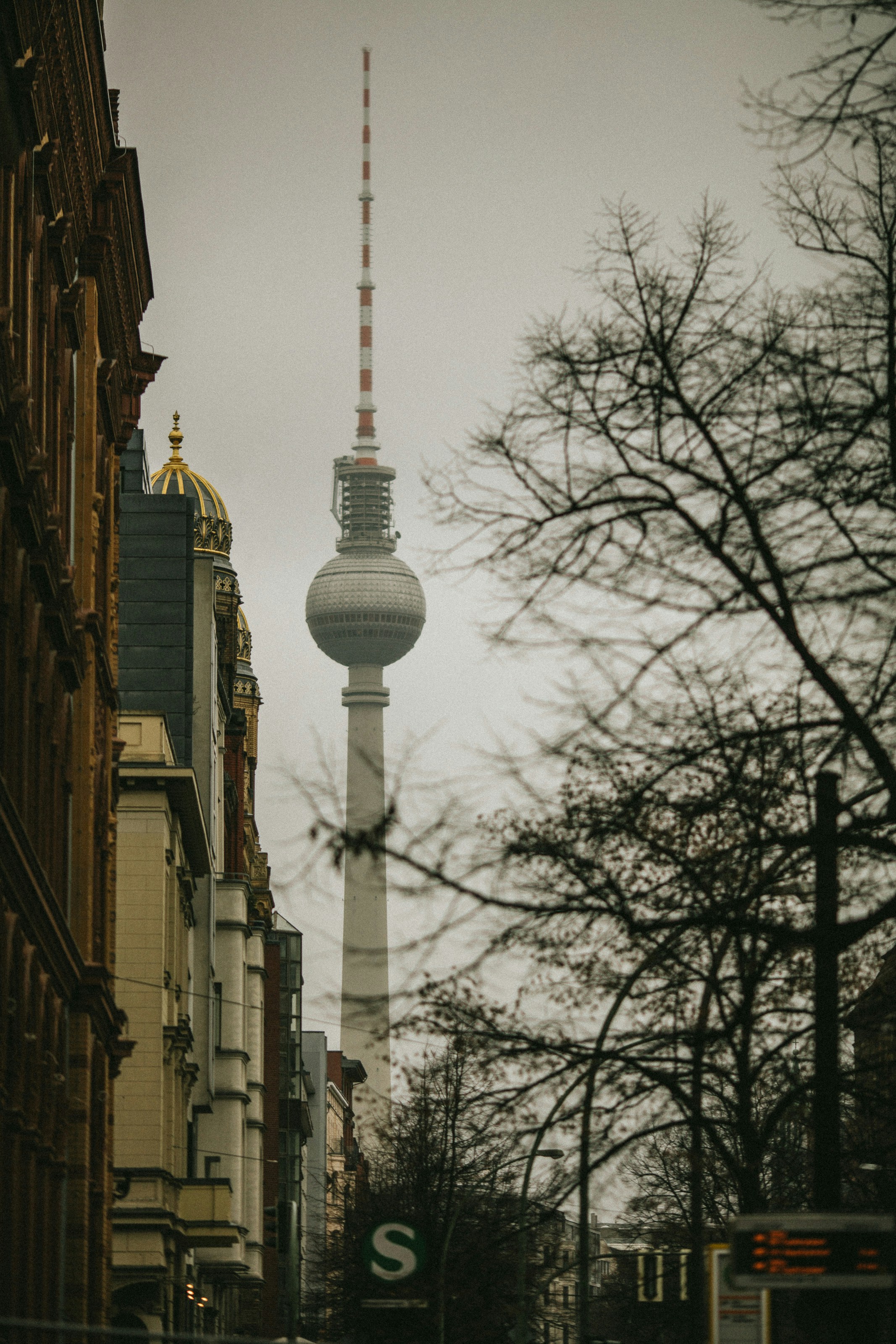 Tower Above the Townhouses: Fernsehturm Framed by a Berlin Street