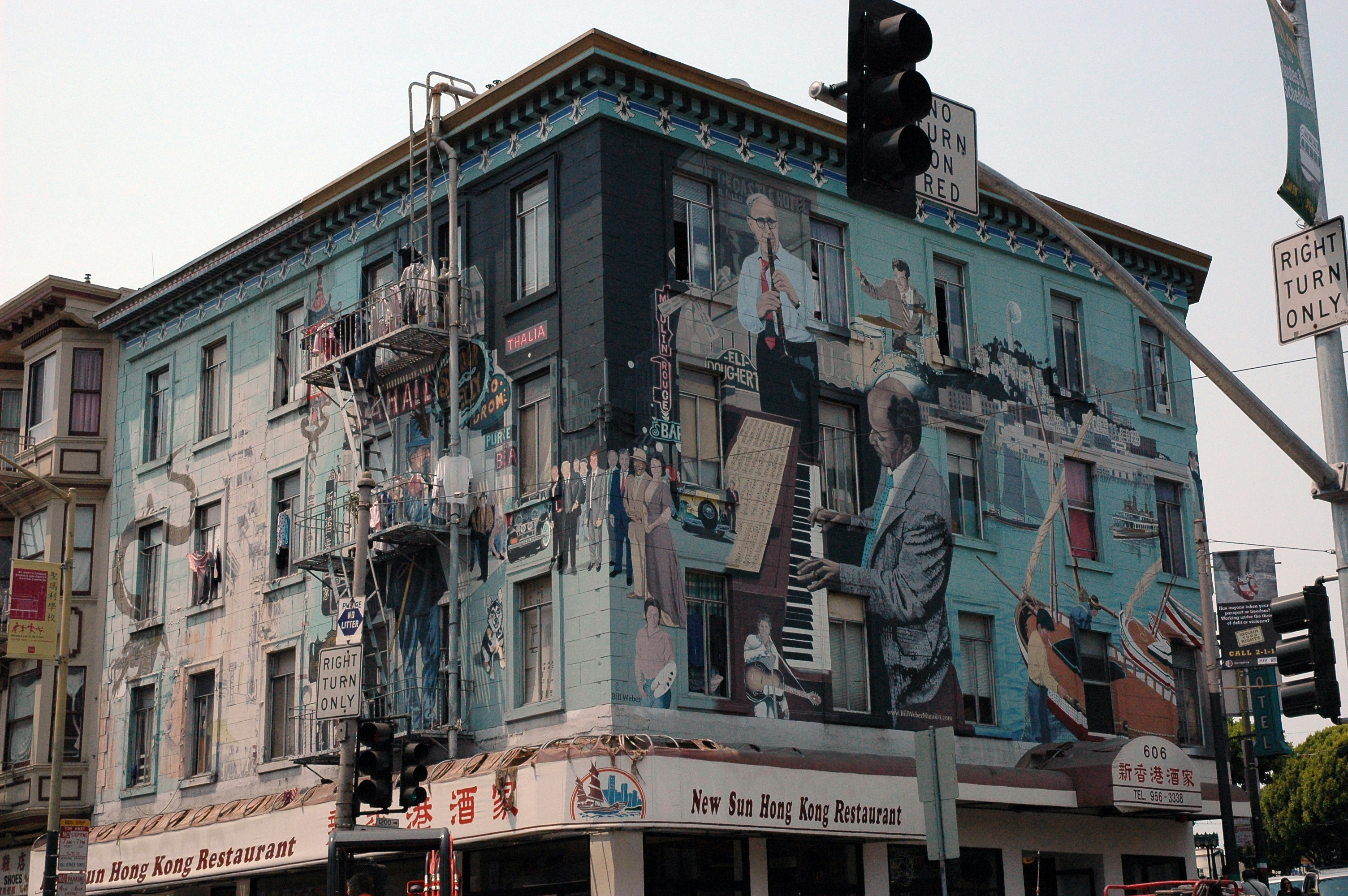 Murals Meet Street: A Cornered Cityscape of Painted Figures