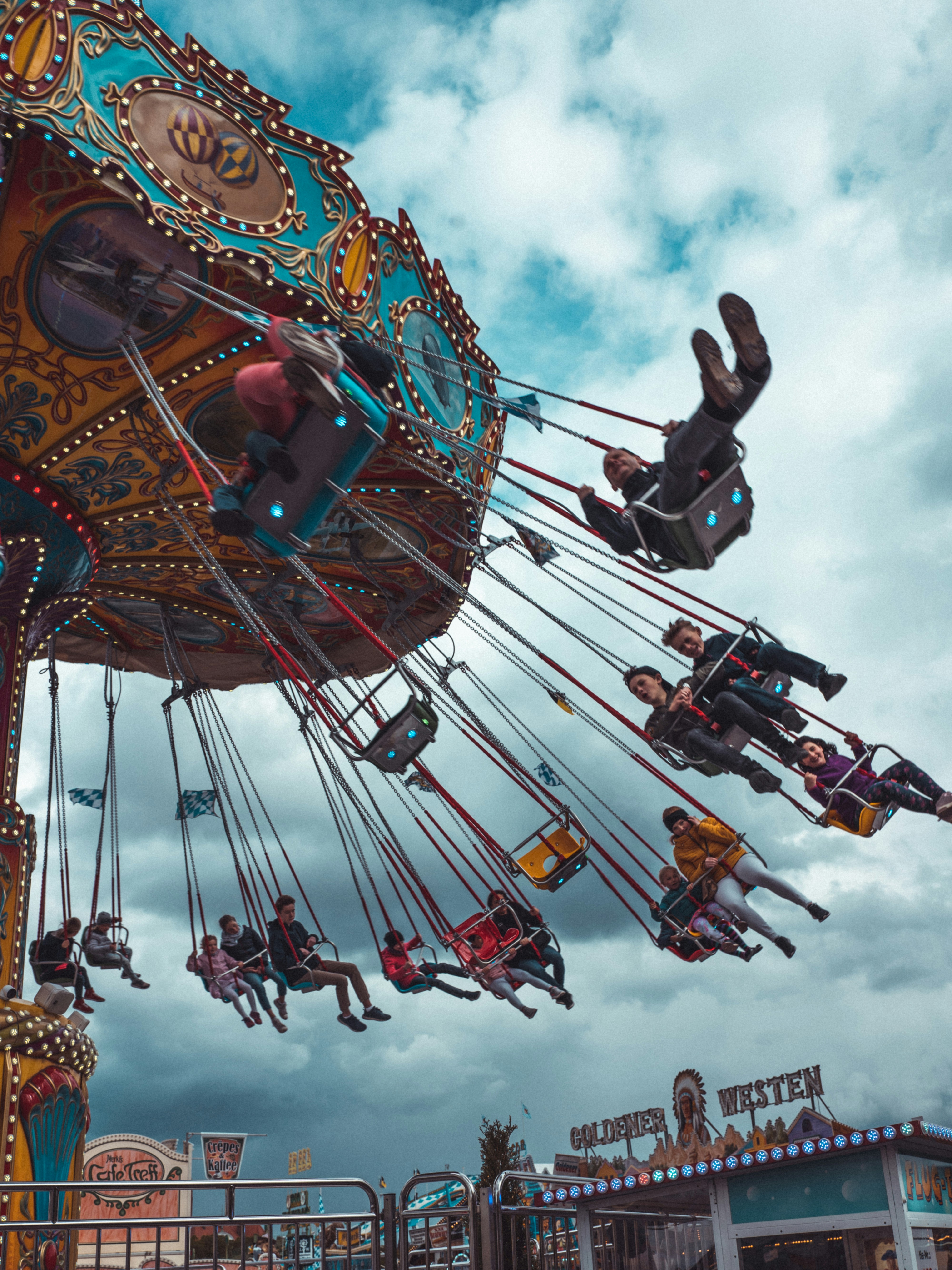 People riding swing amusement ride photo – Free Person Image on Unsplash